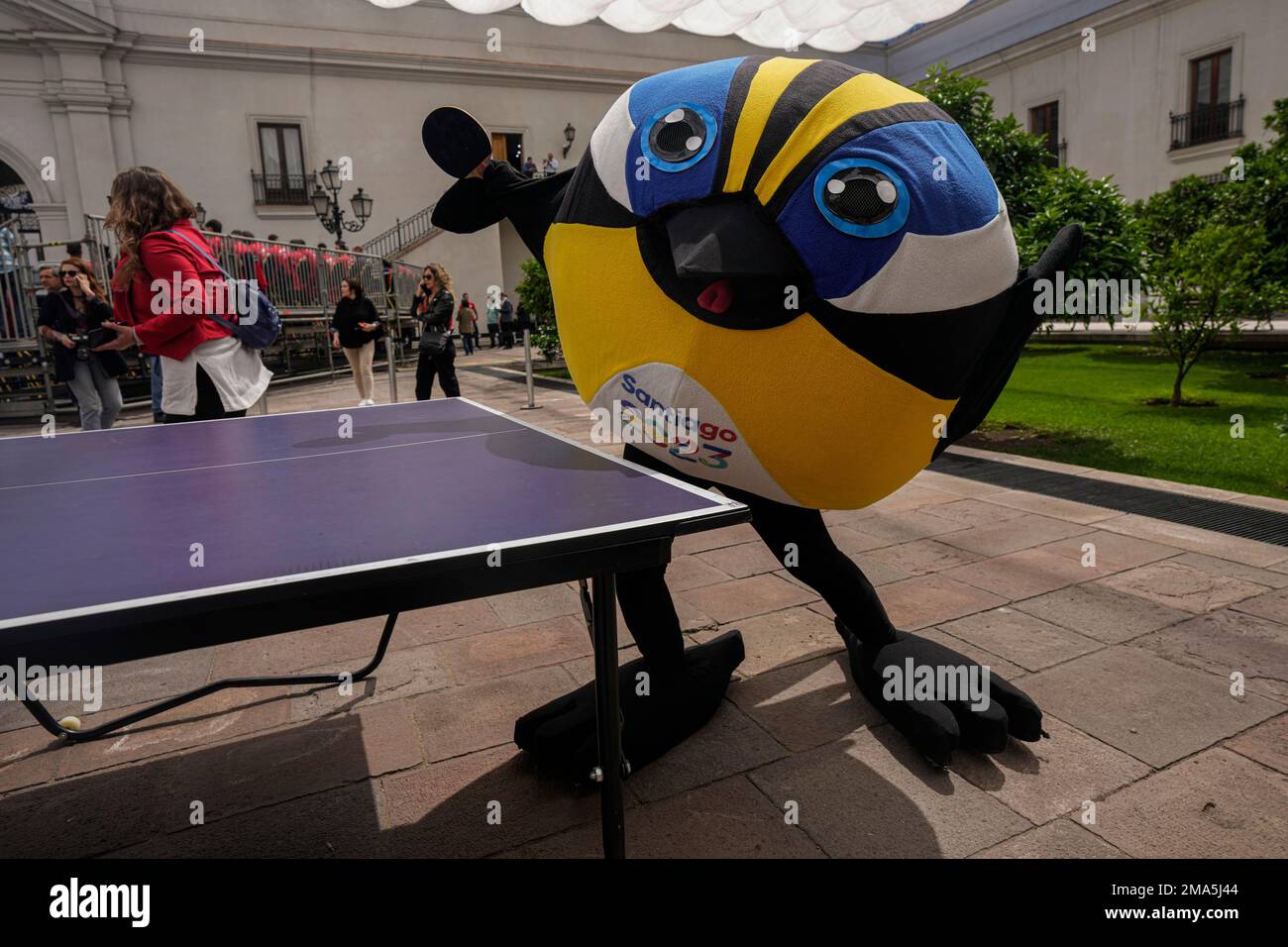 The Pan American Games mascot Fiu, a bird, poses for pictures at a ...