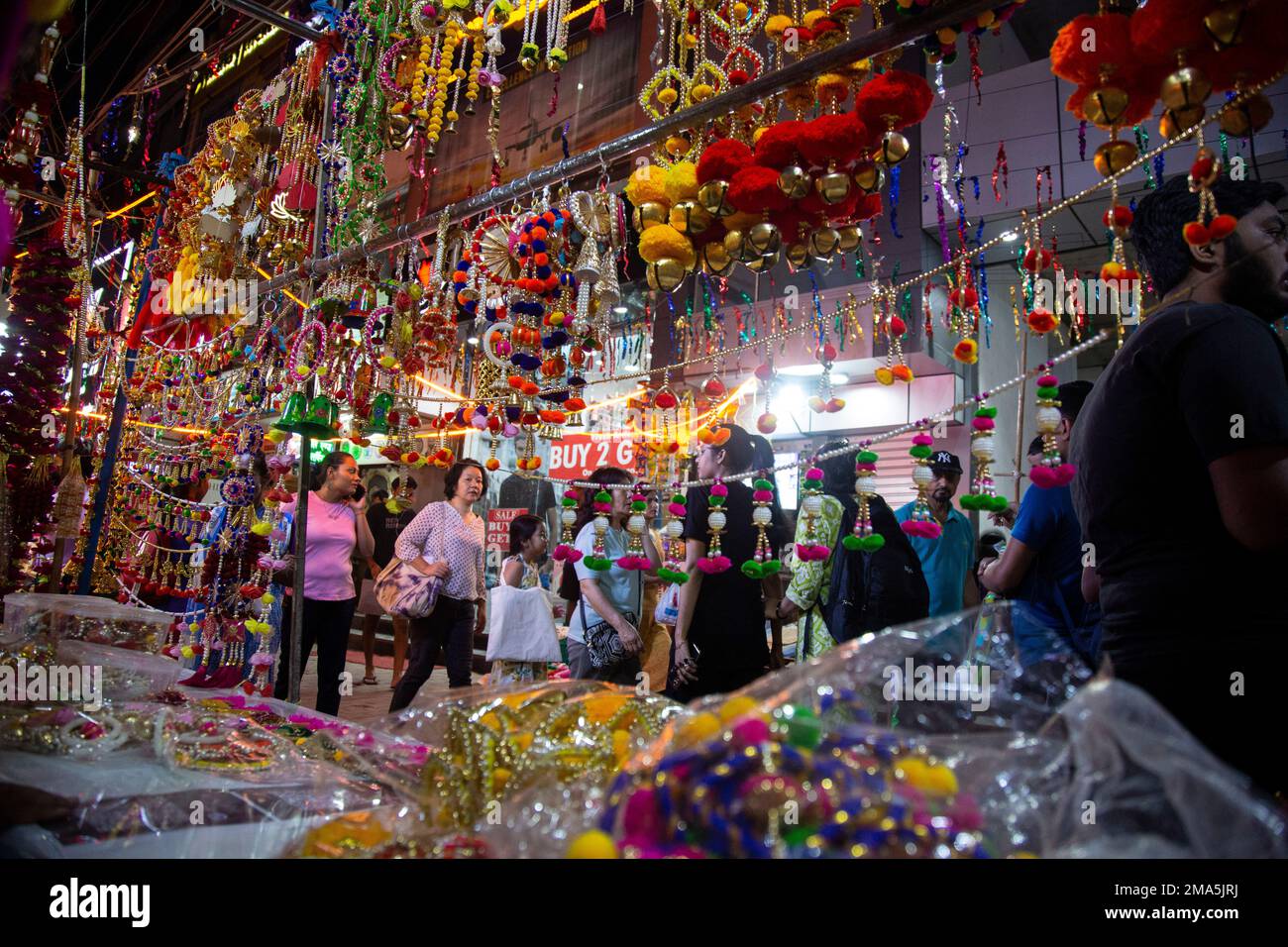 People shop for decorative items, clay lamps and electric lights to ...