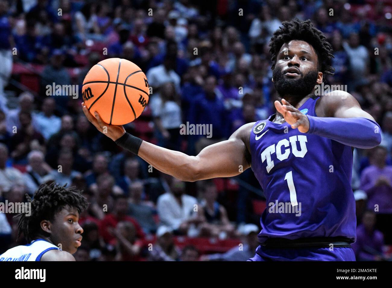 FILE - TCU guard Mike Miles Jr. drives to the basket during the first ...