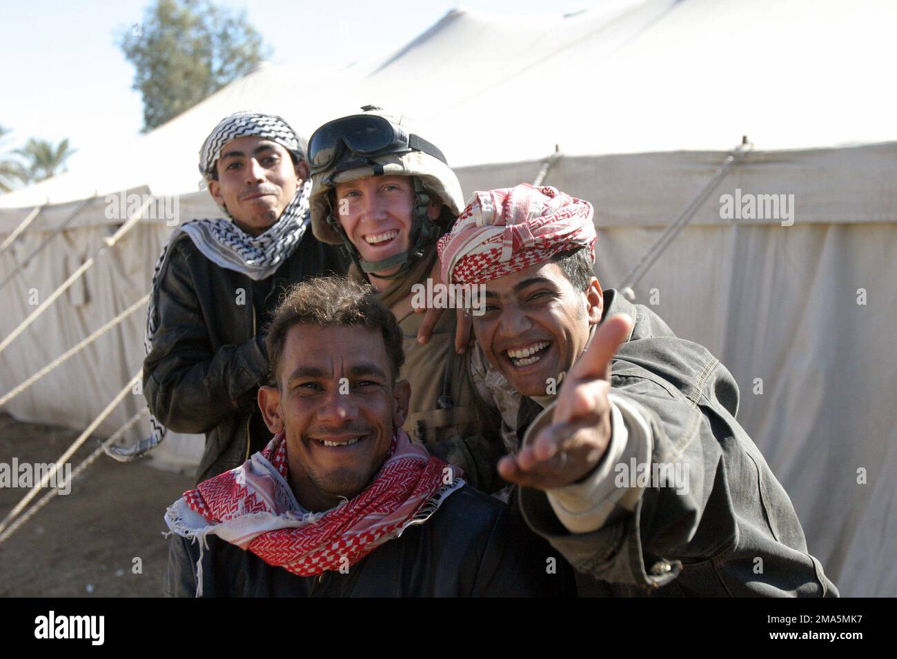 US Marine Corps (USMC) STAFF Sergeant (SSGT) Jonathan C. Knauth (center ...