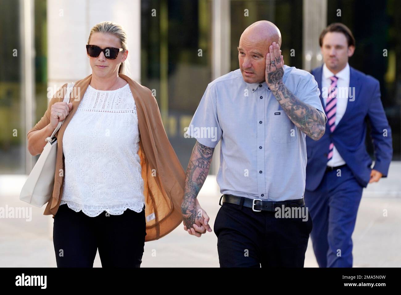 Kevin Michael Brophy and his wife Lindsay leave federal court as ...