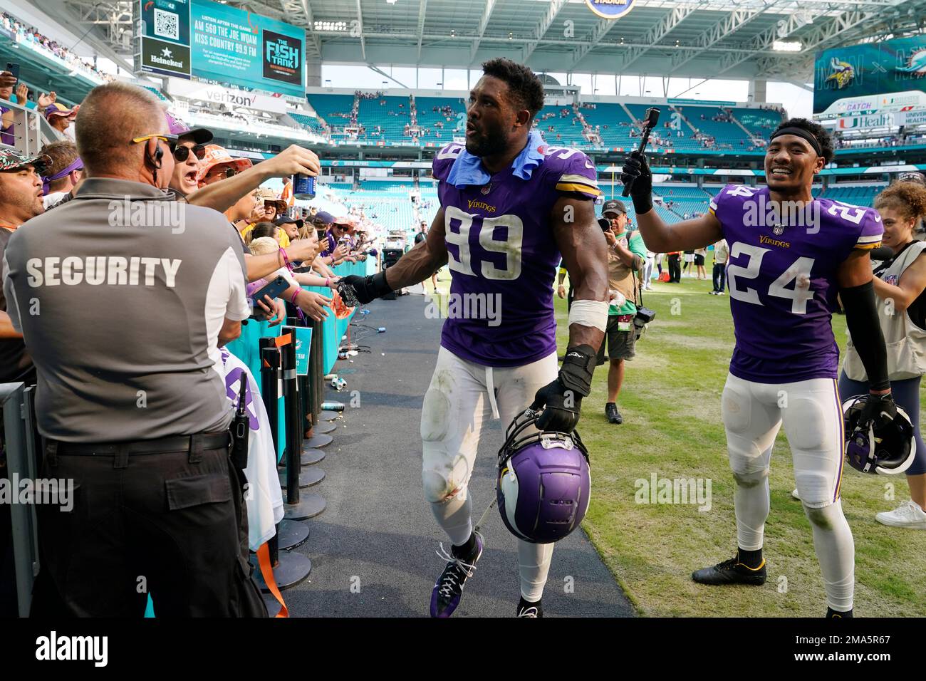 Minnesota Vikings linebacker Danielle Hunter (99) and safety Camryn ...