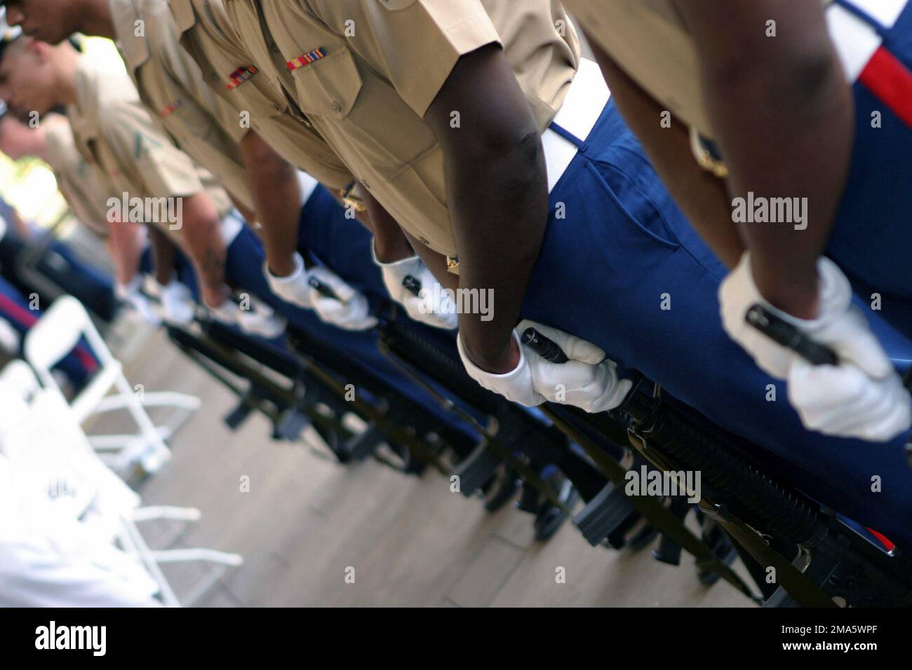 Members of the US Marine Corps (USMC) Base Honor Guard Team stand at ...