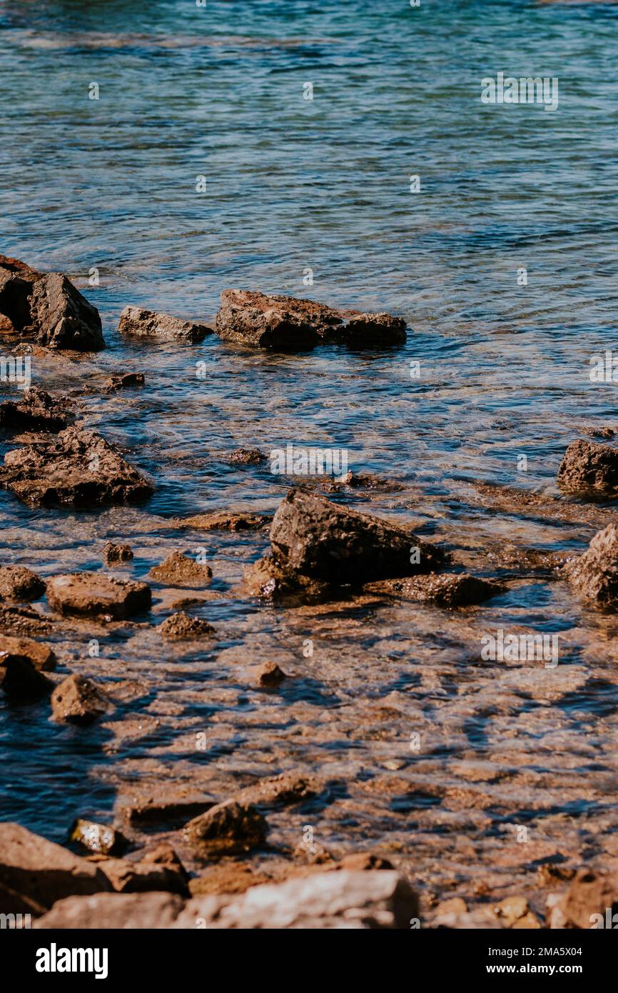 Summer coastline near an island on the deep blue ocean Stock Photo - Alamy