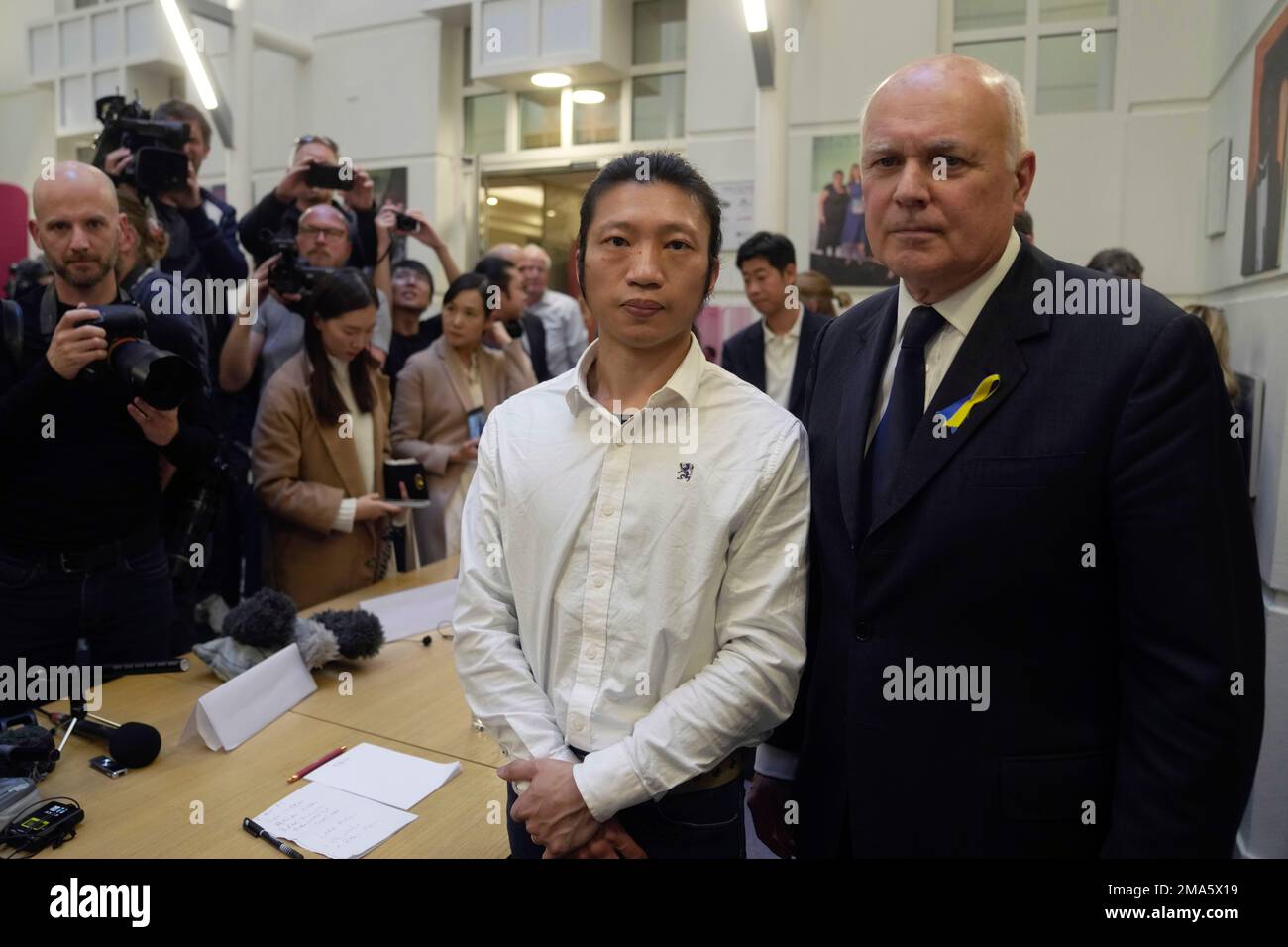 Hong Kong protester Bob Chan, left, who alleged he was dragged into the ...