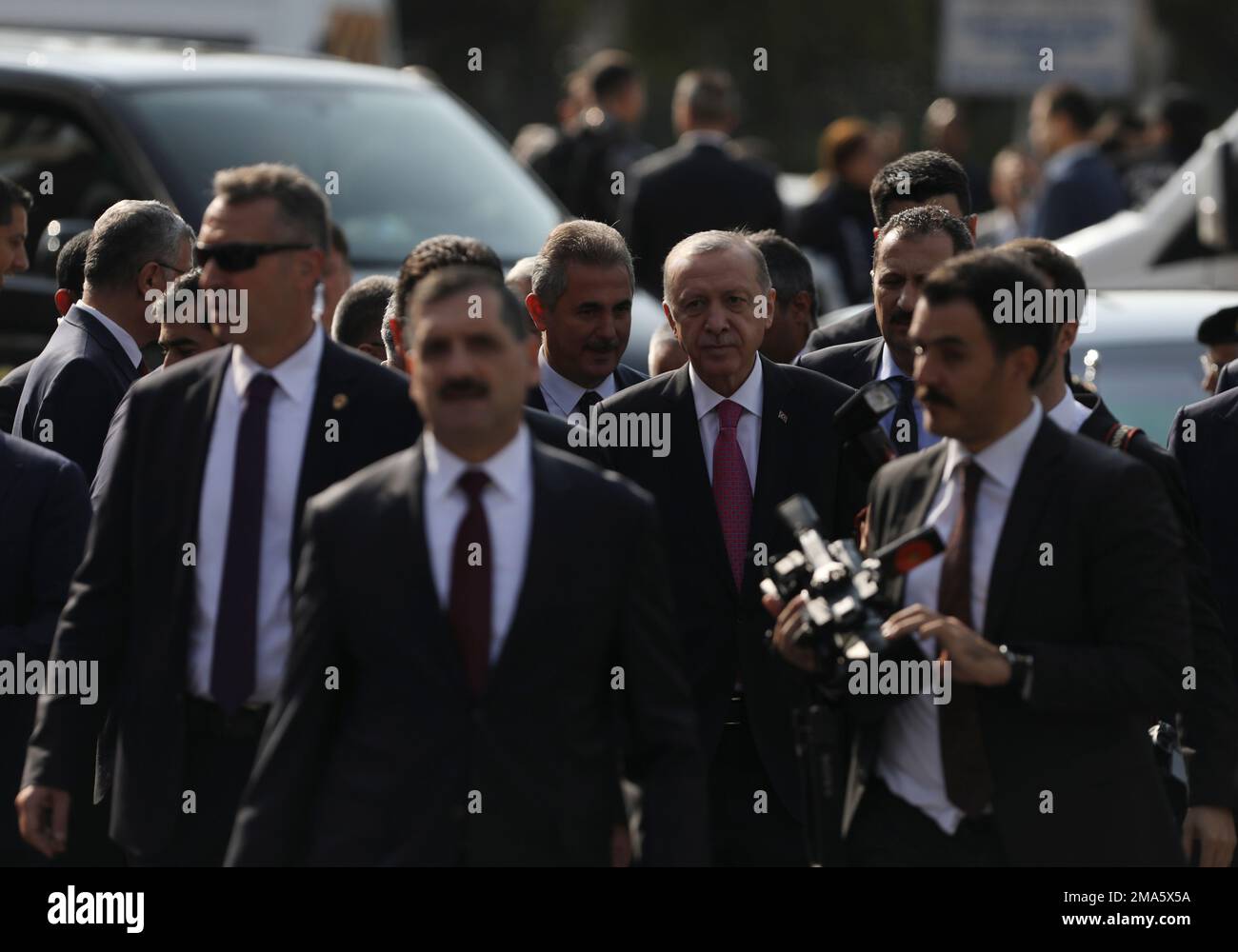 Turkish President Recep Tayyip Erdogan, center, arrives to speak at an ...