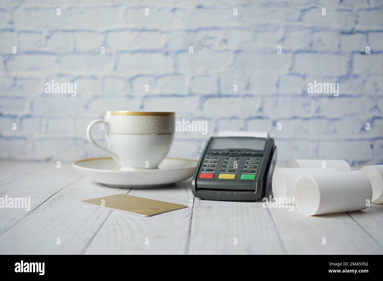 POS machine and long roll paper on blue Stock Photo - Alamy