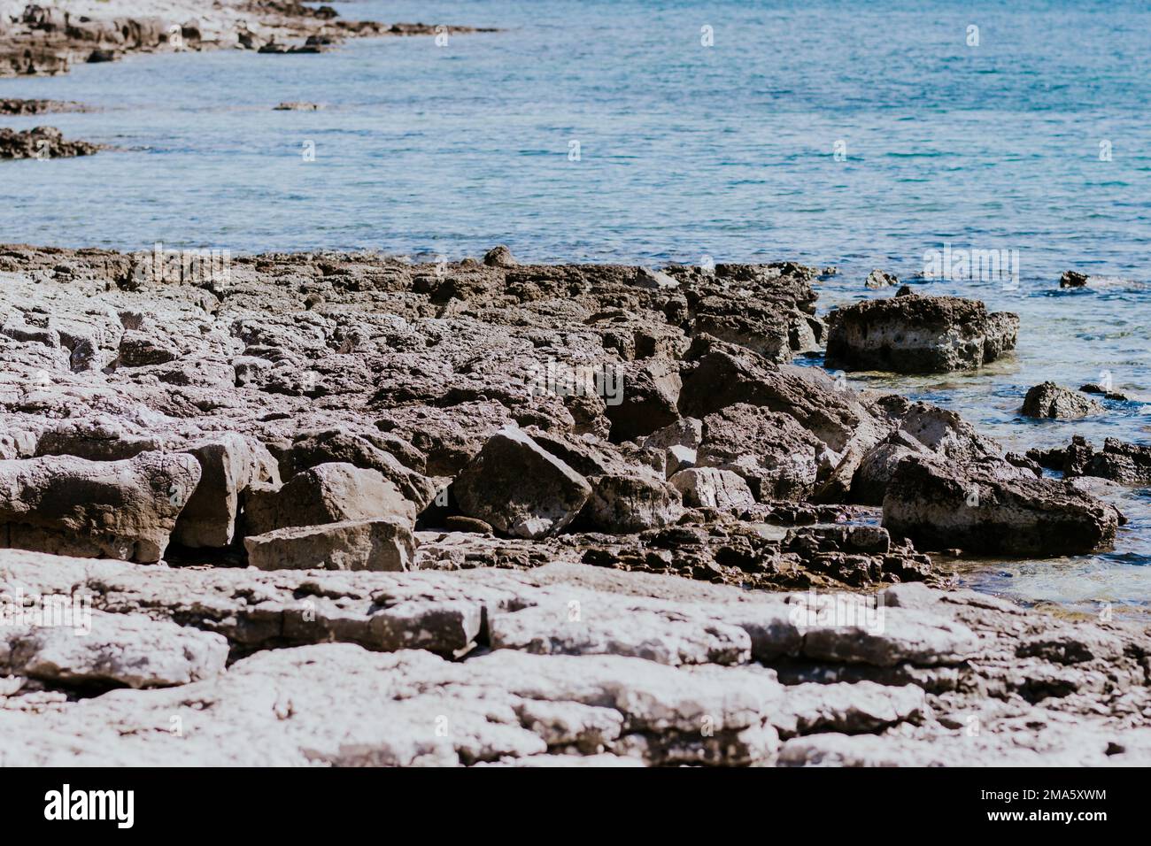 Summer coastline near an island on the deep blue ocean Stock Photo - Alamy