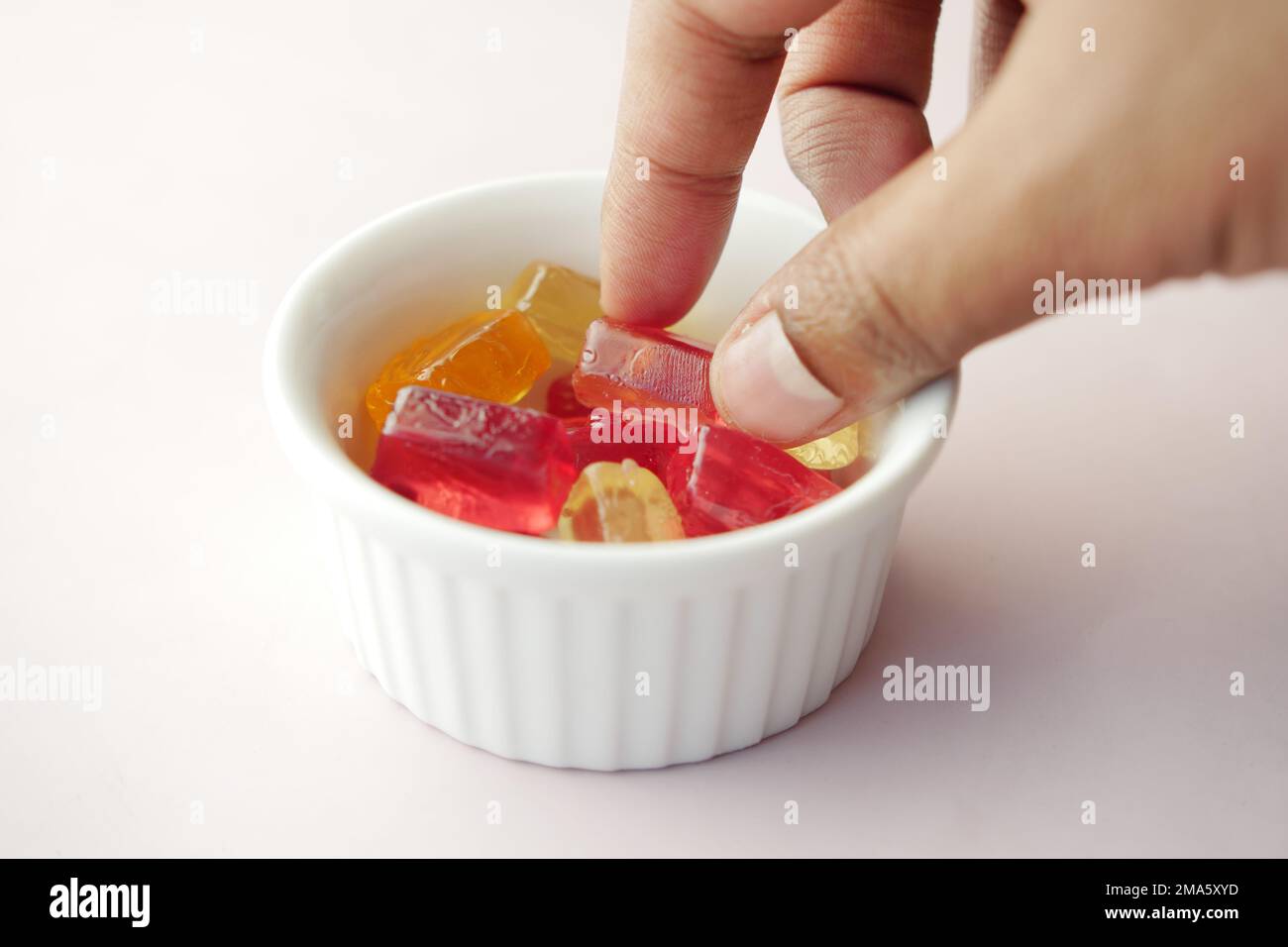 hand pick colorful sweet candy Stock Photo - Alamy