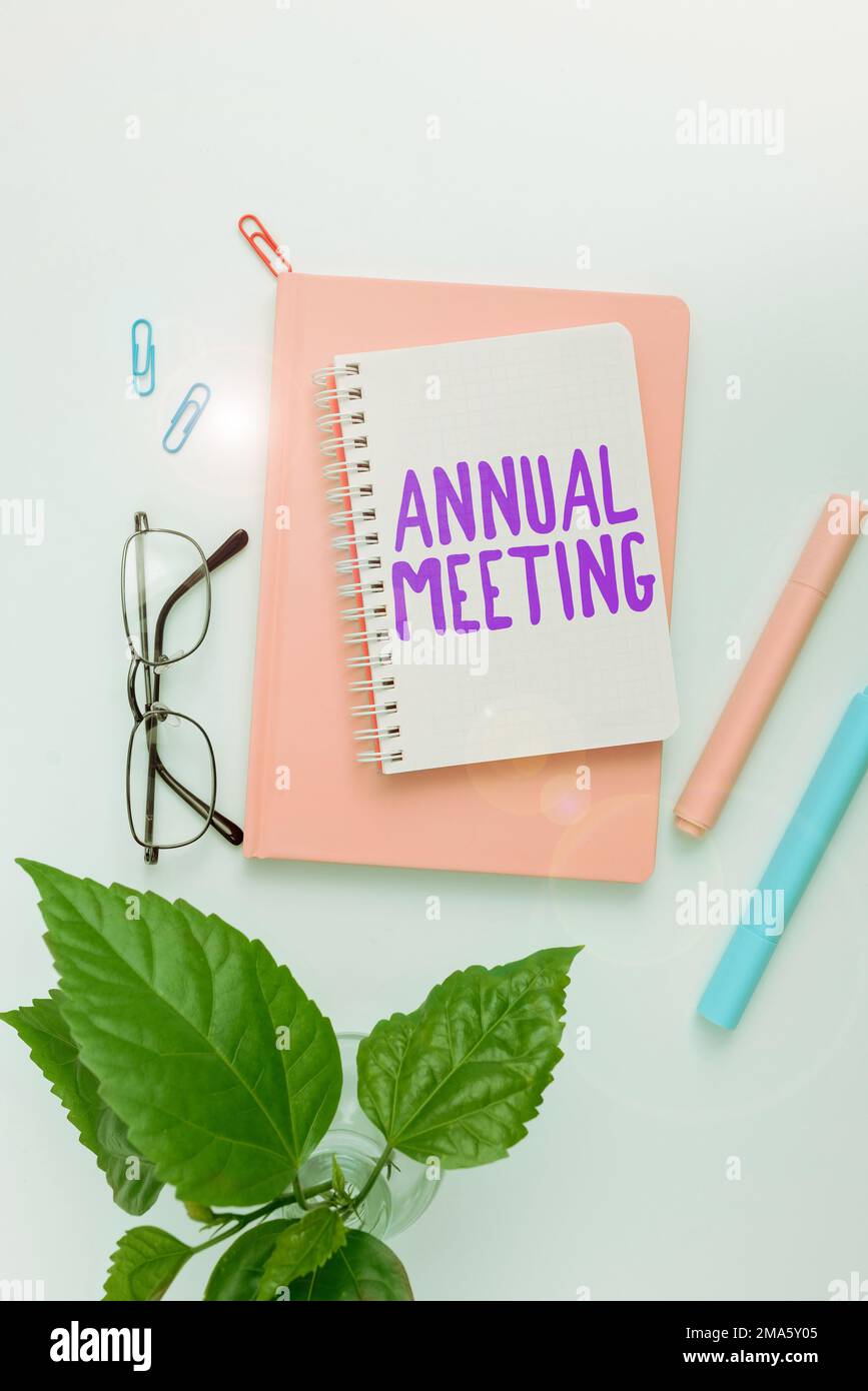 Hand writing sign Annual Meeting. Word Written on Yearly gathering of ...