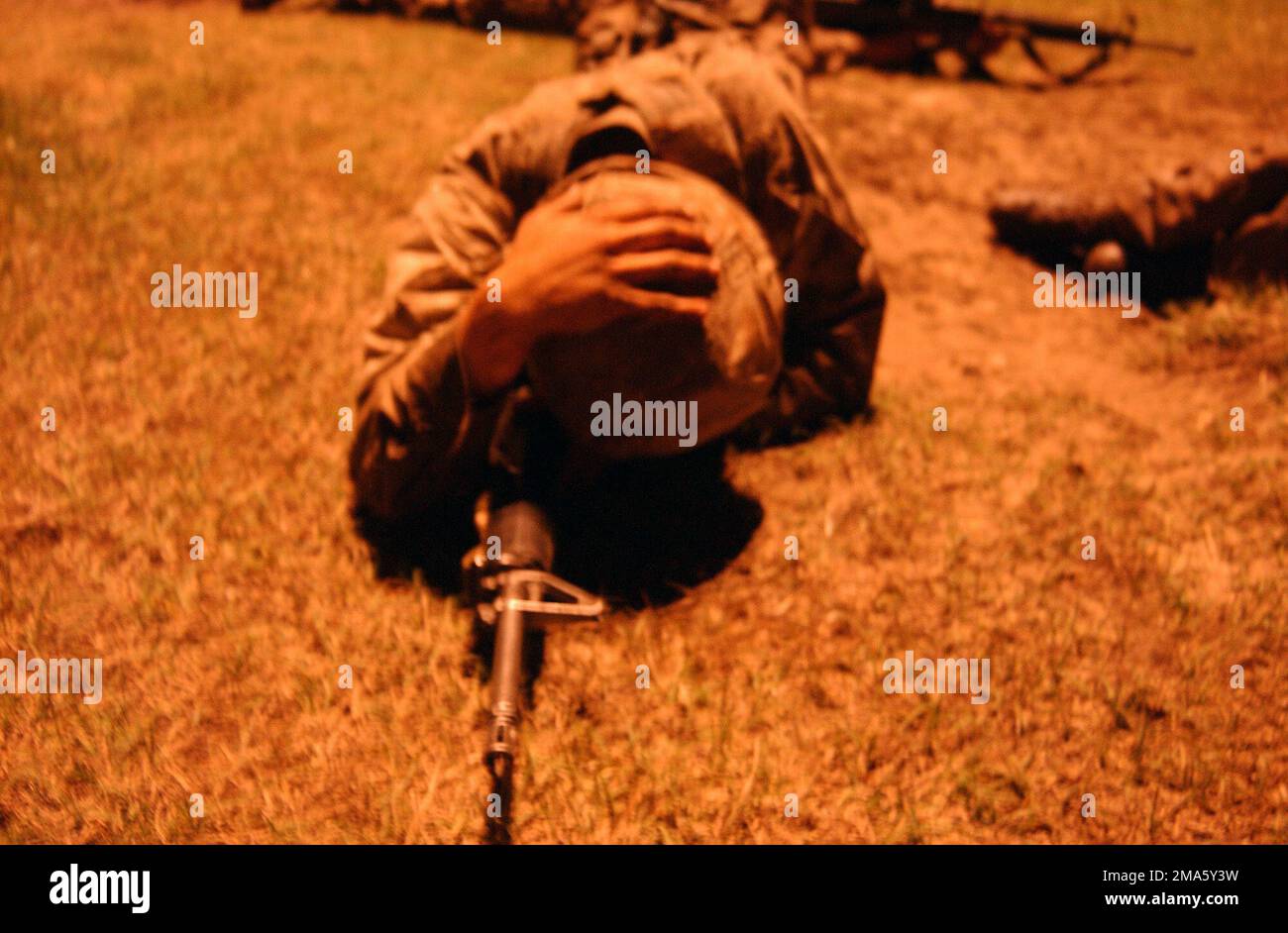 US Marine Corps (USMC) Recruits, pauses and cover, as flairs light up ...