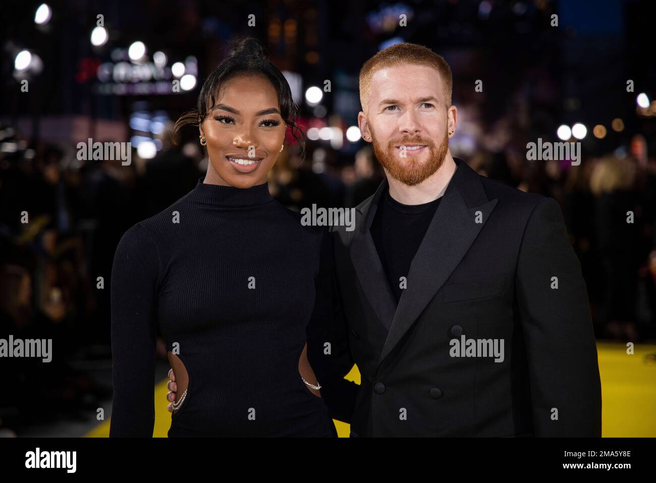 Chyna Mills and Neil Jones pose for photographers upon arrival for the ...