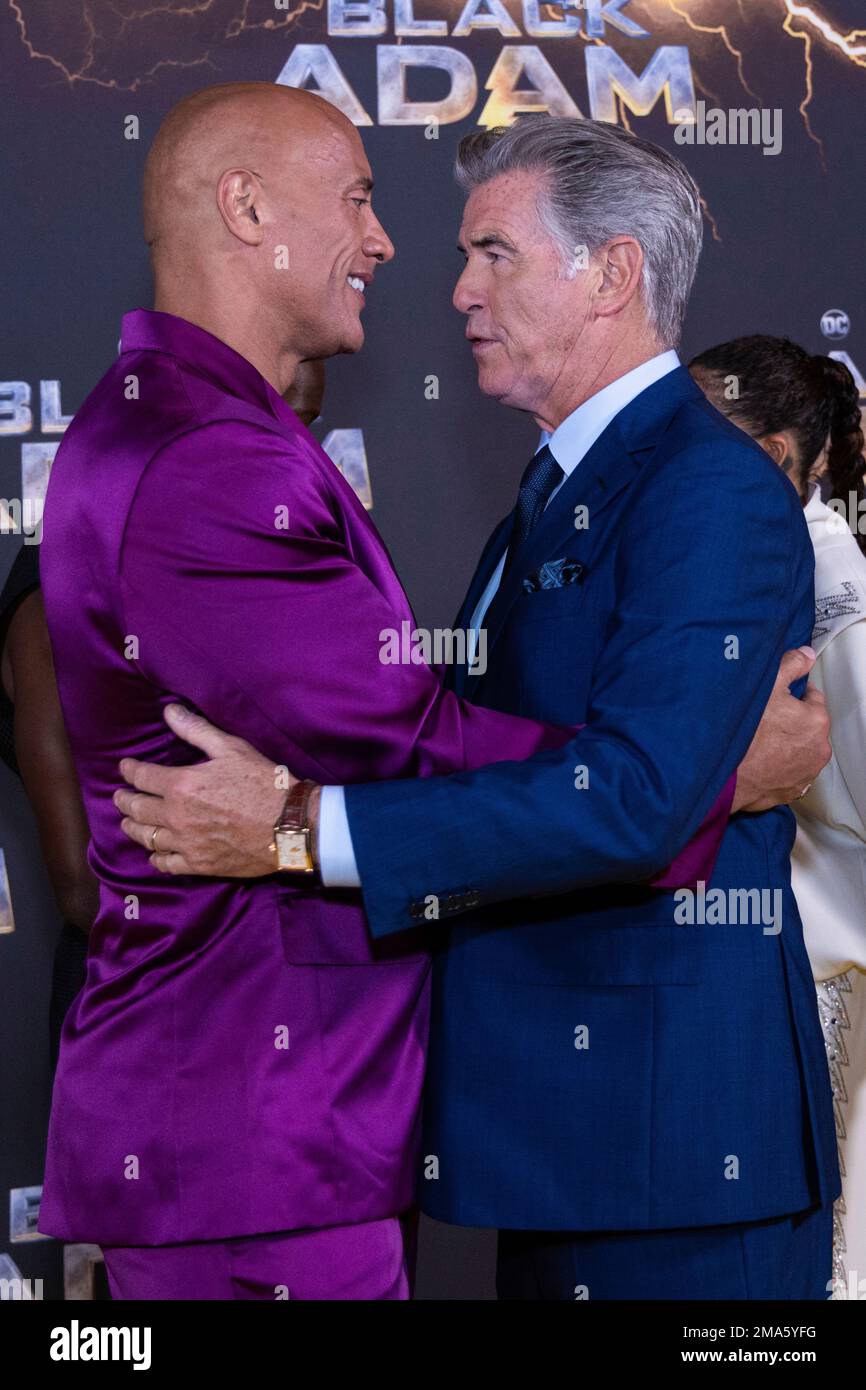 Dwayne Johnson a.k.a. The Rock, left, and Pierce Brosnan poses for ...