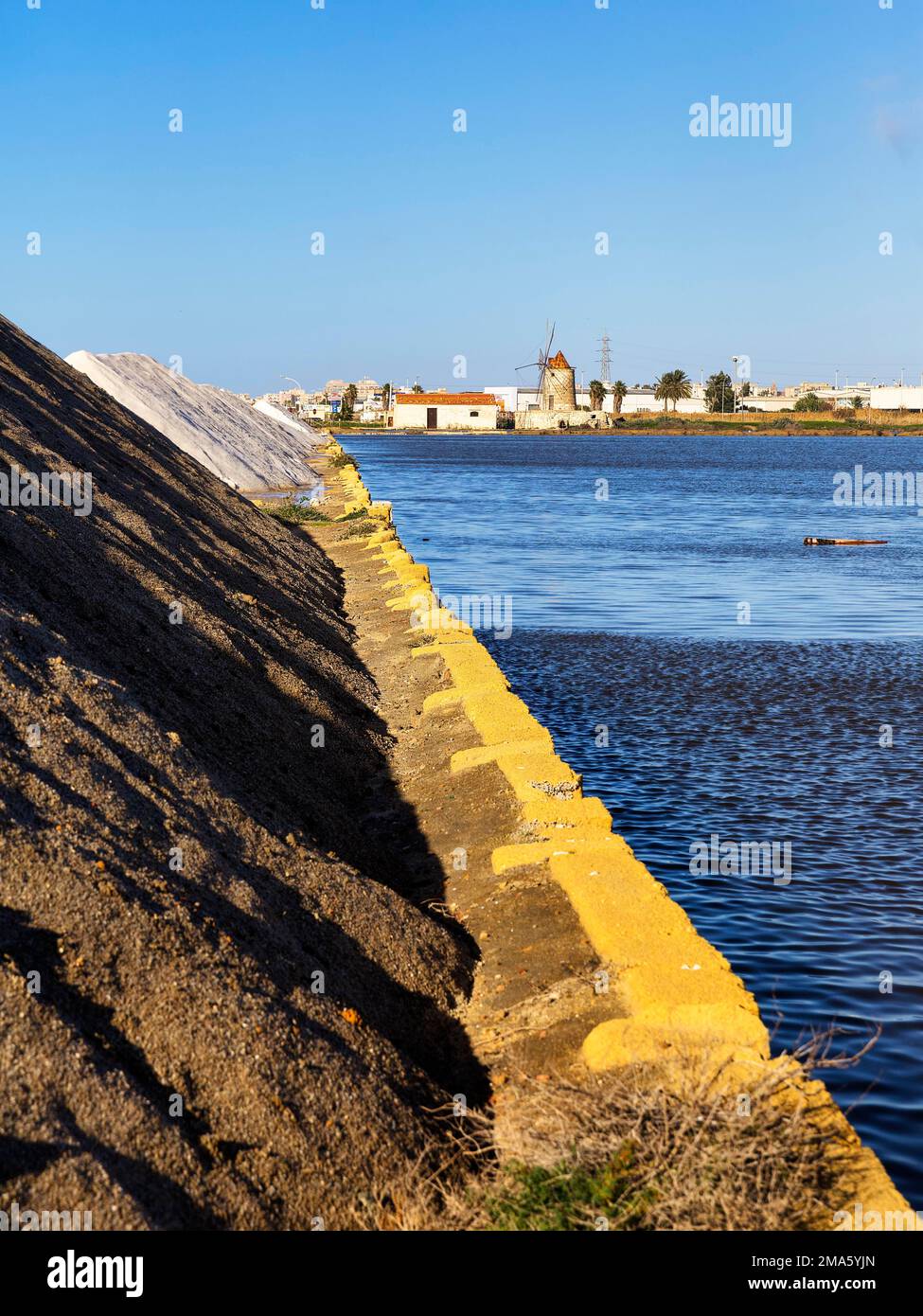 Spoil heap at salt works, traditional windmill for salt extraction on ...