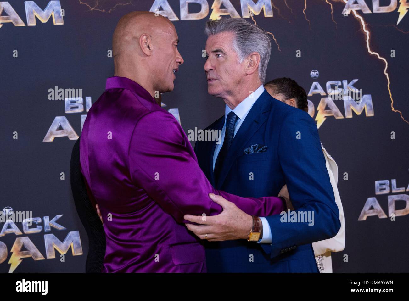 Dwayne Johnson a.k.a. The Rock, left, and Pierce Brosnan poses for ...