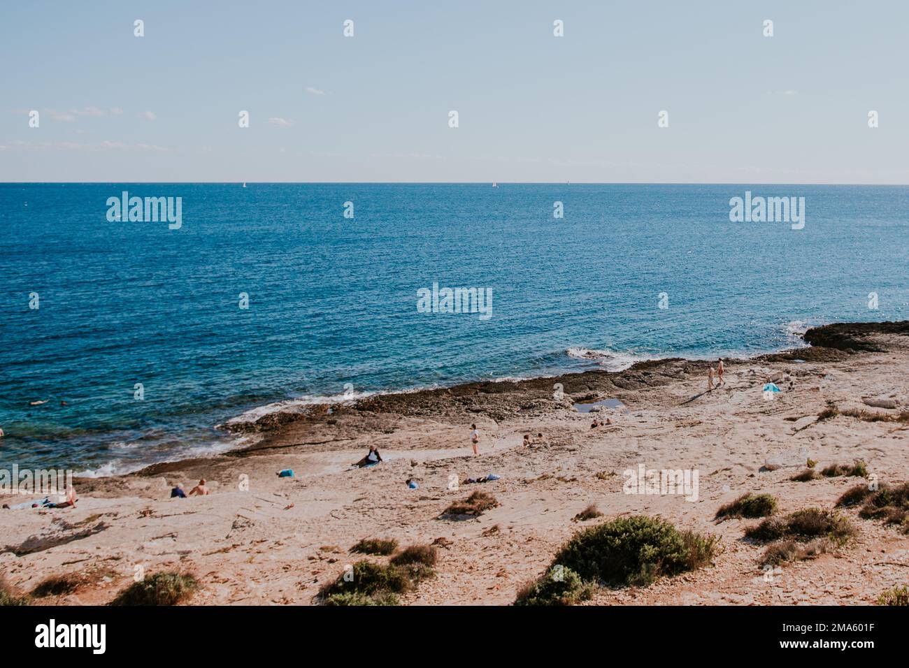 Summer coastline near an island on the deep blue ocean Stock Photo - Alamy