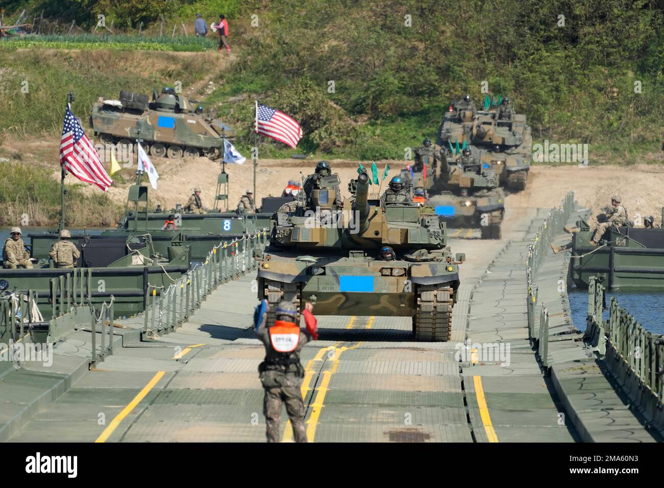 South Korean Army K2 tanks cross a floating bridge on the Namhan River ...