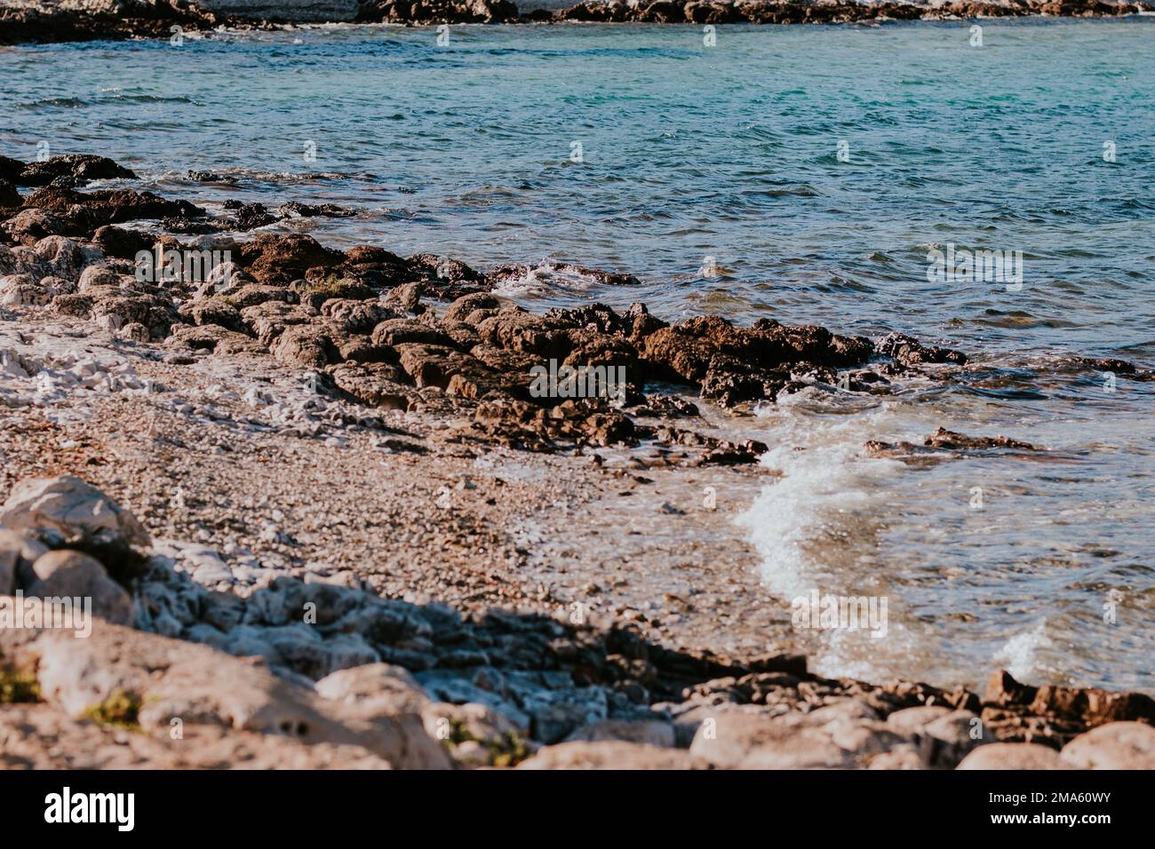 Summer coastline near an island on the deep blue ocean Stock Photo - Alamy