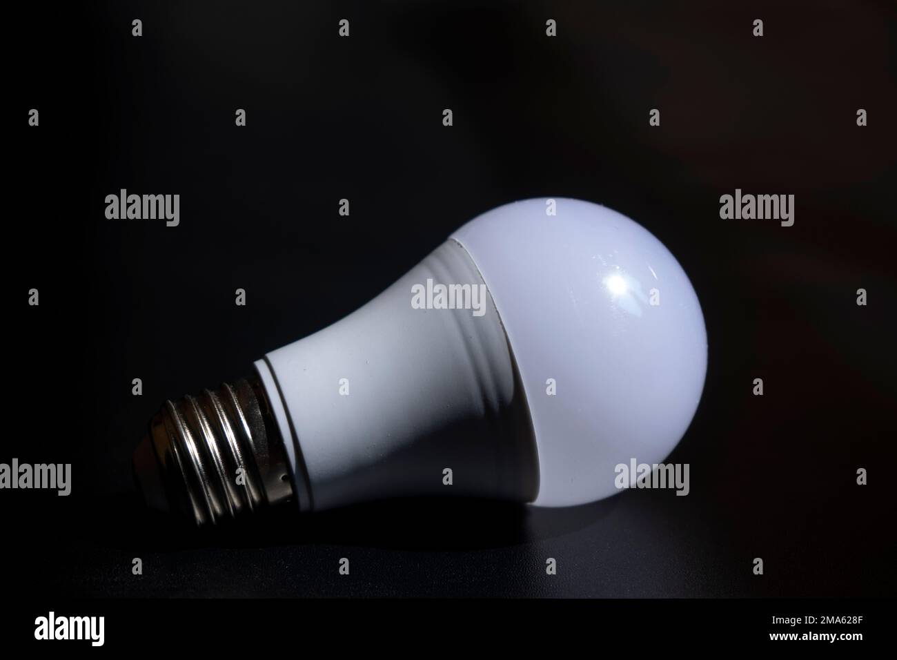 White LED lamp on a black background Stock Photo - Alamy