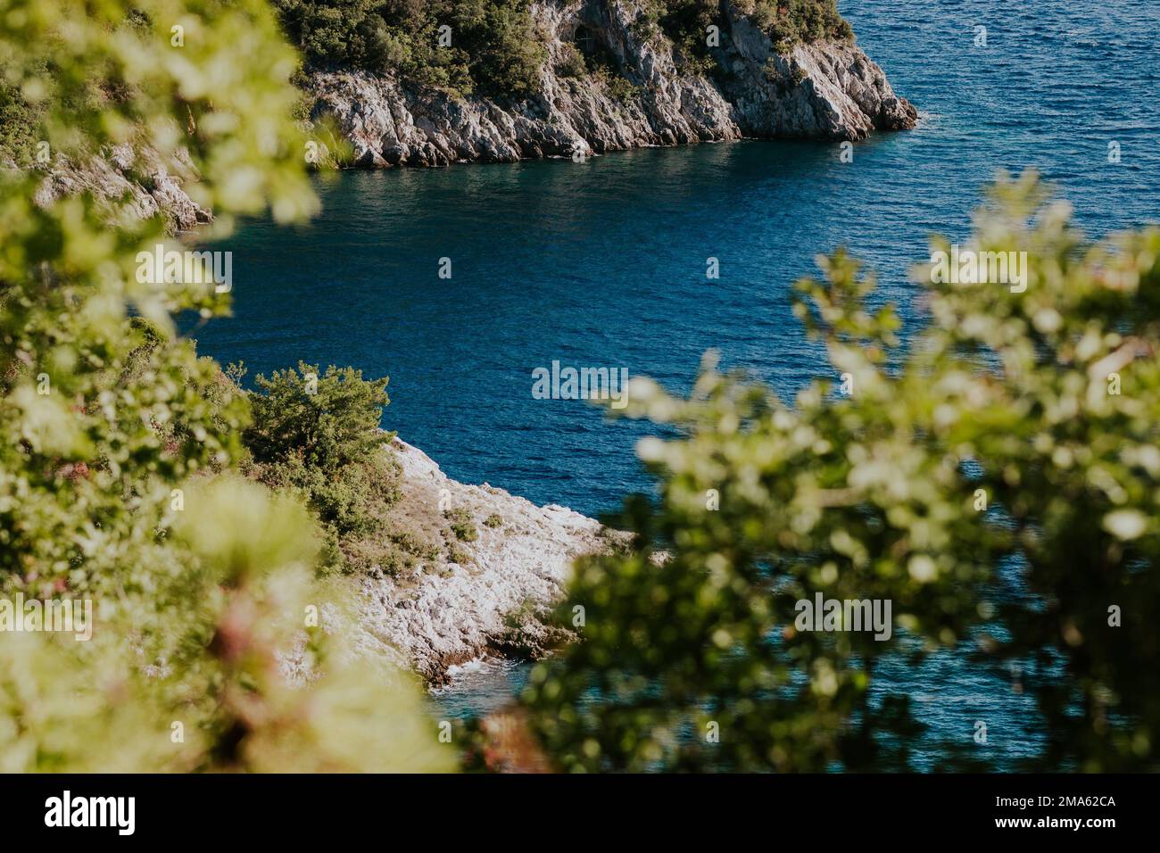 Summer coastline near an island on the deep blue ocean Stock Photo - Alamy