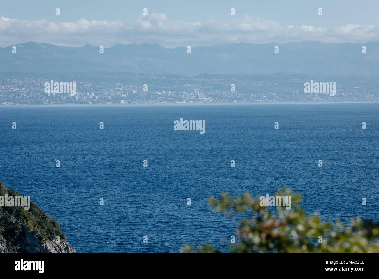 Summer coastline near an island on the deep blue ocean Stock Photo - Alamy