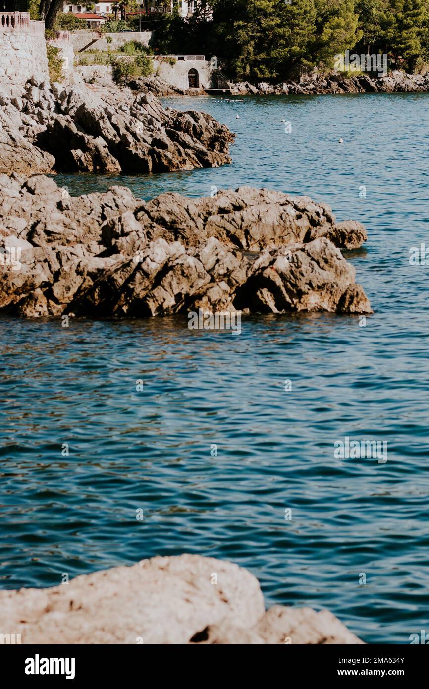 Summer coastline near an island on the deep blue ocean Stock Photo - Alamy