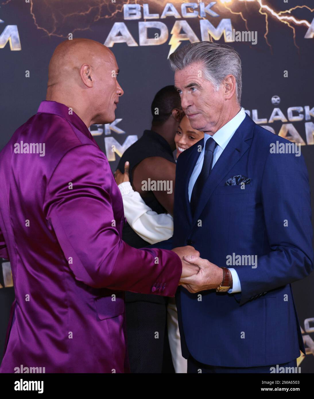 Dwayne Johnson, left, and Pierce Brosnan poses for photographers upon ...