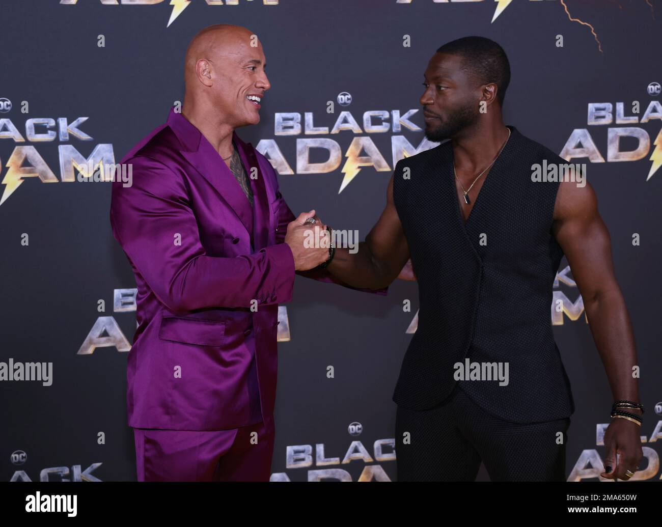 Dwayne Johnson, left, and Aldis Hodge pose for photographers upon ...