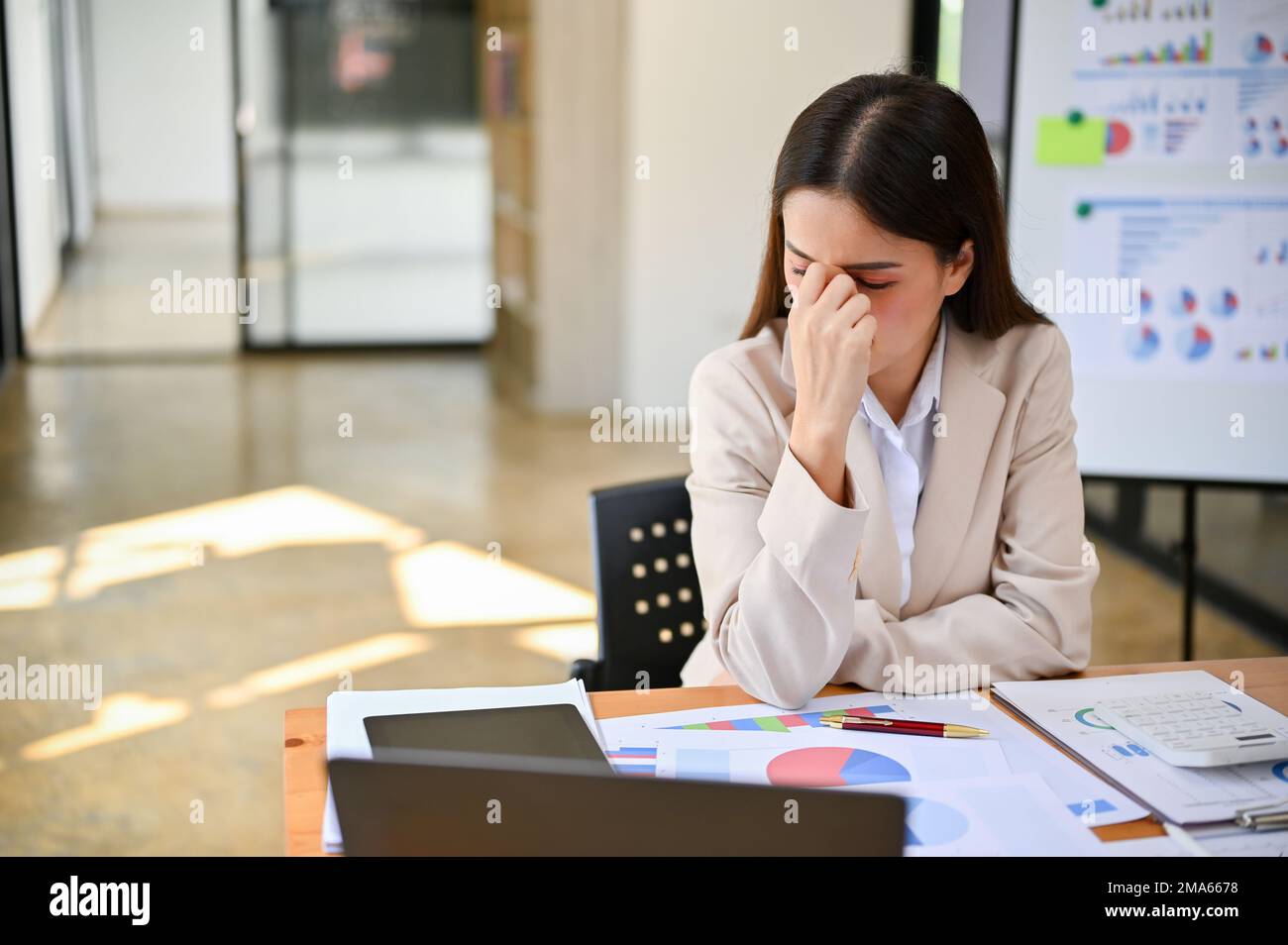 Stressed and depressed millennial Asian businesswoman or female ...