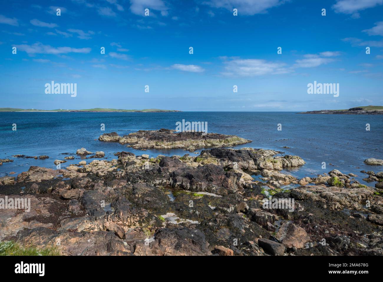 Coastal scene with view of the island of Papa Stour, West Mainland ...