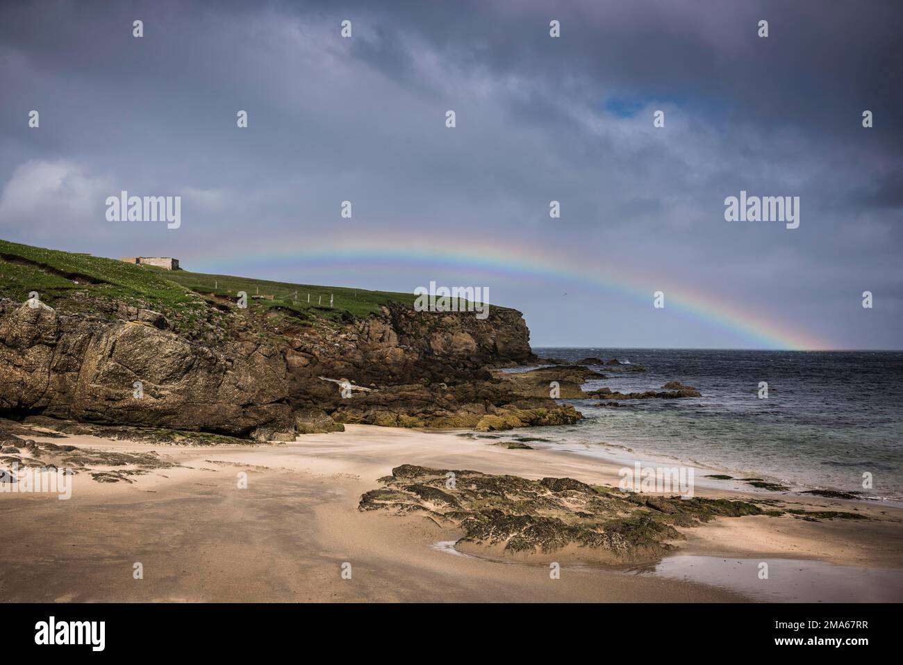Coastal scene with rainbow at Skaw, Unst, Shetland Islands, Scotland ...