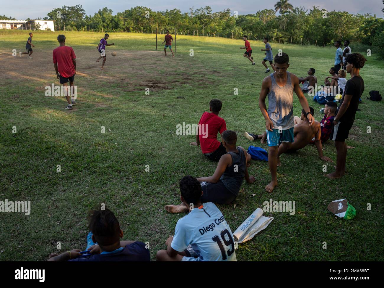 Locals play soccer on an old baseball field in the Santa Fe ...