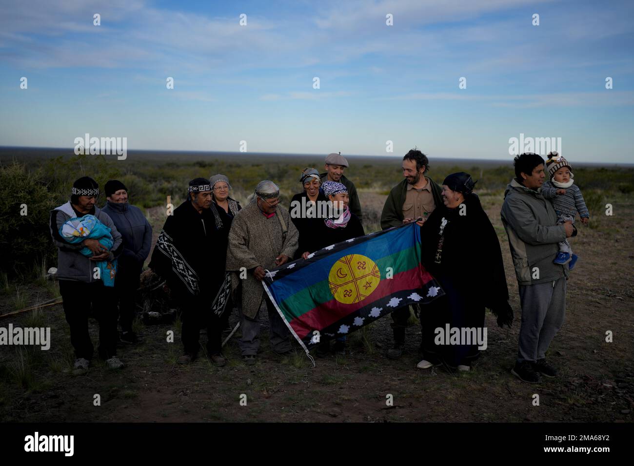 Indigenous Mapuche pose for photos with their Indigenous flag at the ...