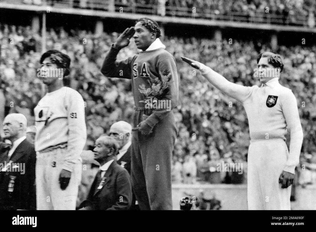 FILE - In this Aug. 11, 1936, file photo, America's Jesse Owens, center ...