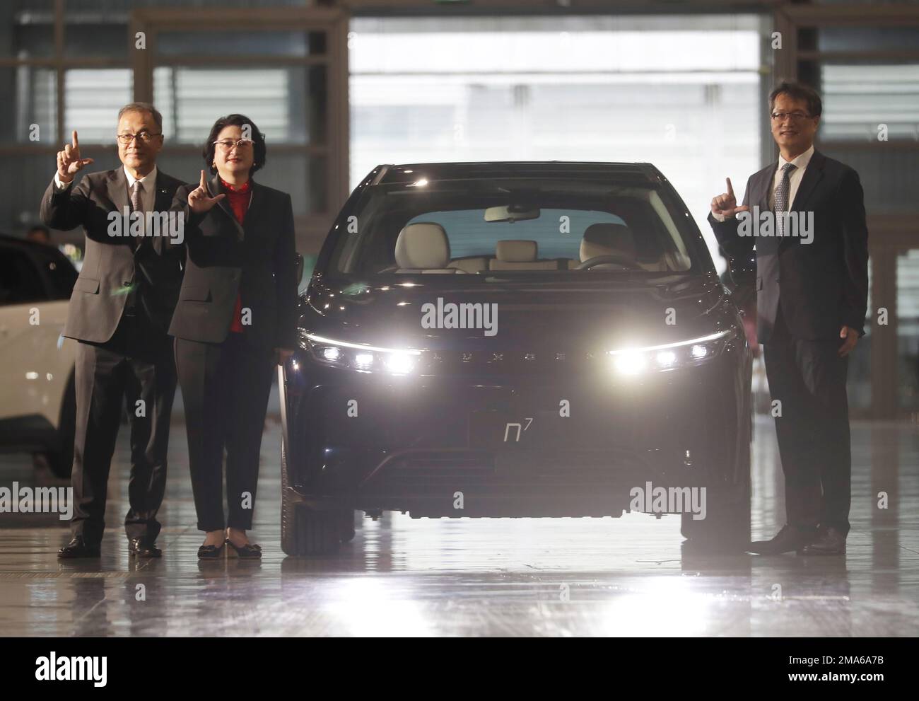 Luxgen chairperson Tso Zi-sheng, from left, and Yulon Motor chairperson ...
