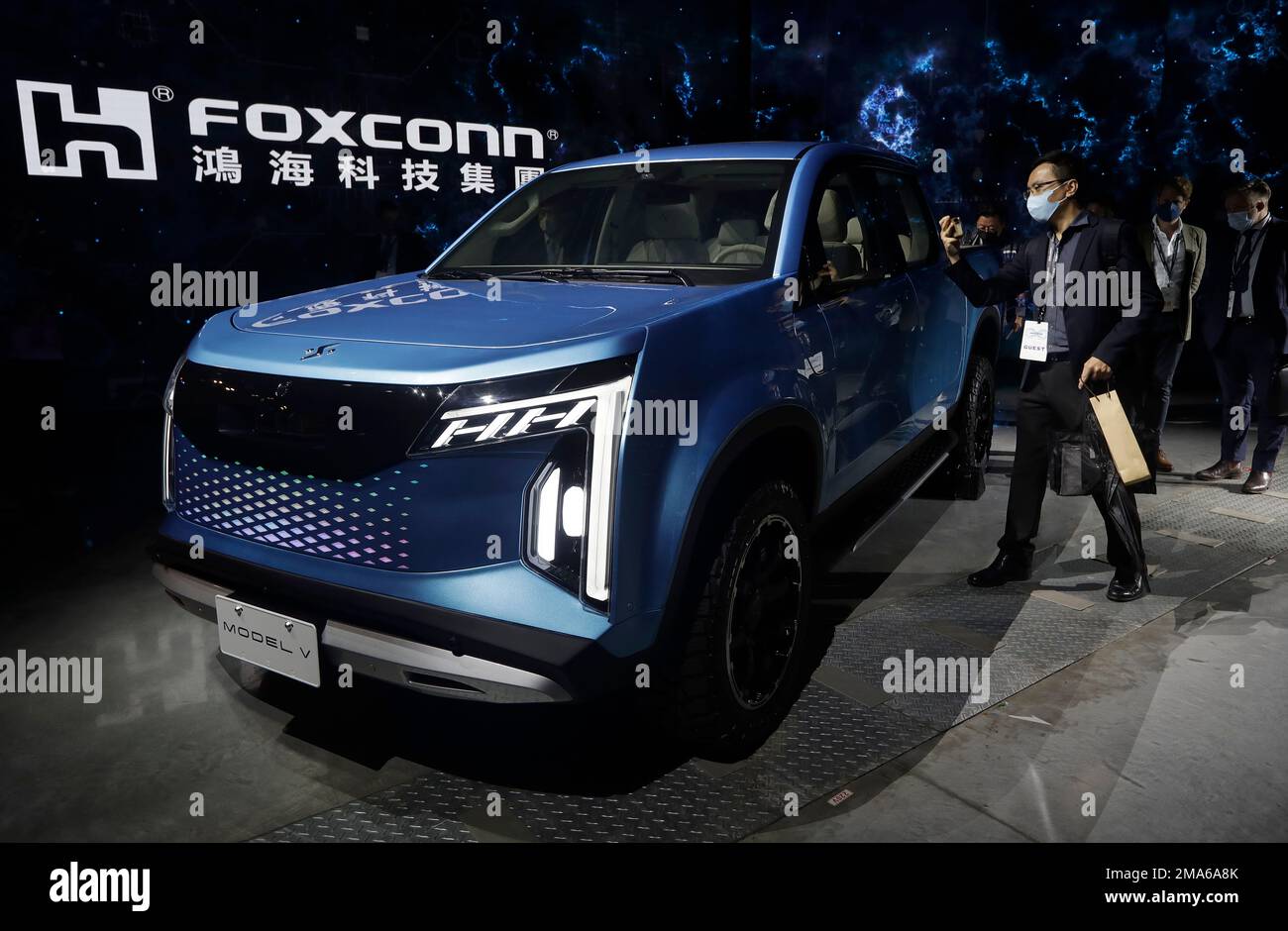 People look at the Foxtron Model V electric car during the 2022 Hon Hai Tech Day (HHTD 22) at ...