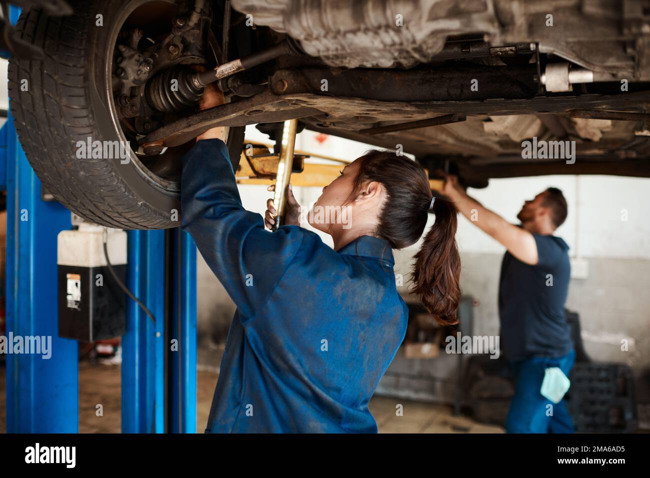 Auto mechanics provide a service that is invaluable. two mechanics ...