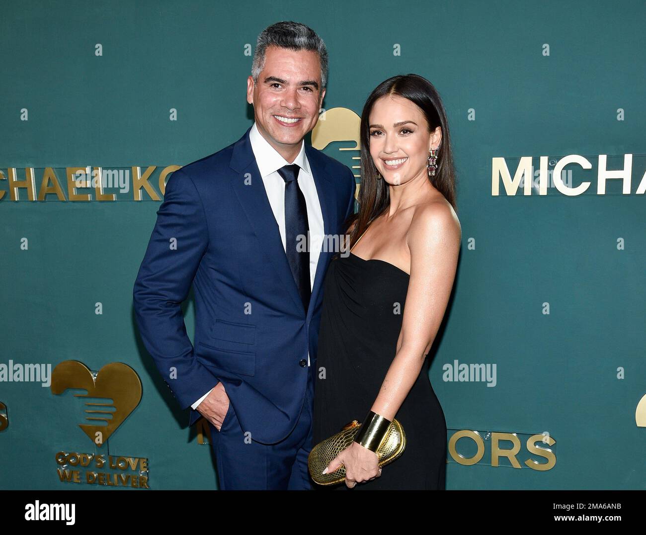 Jessica Alba, right, and husband Cash Warren attend the God's Love We ...