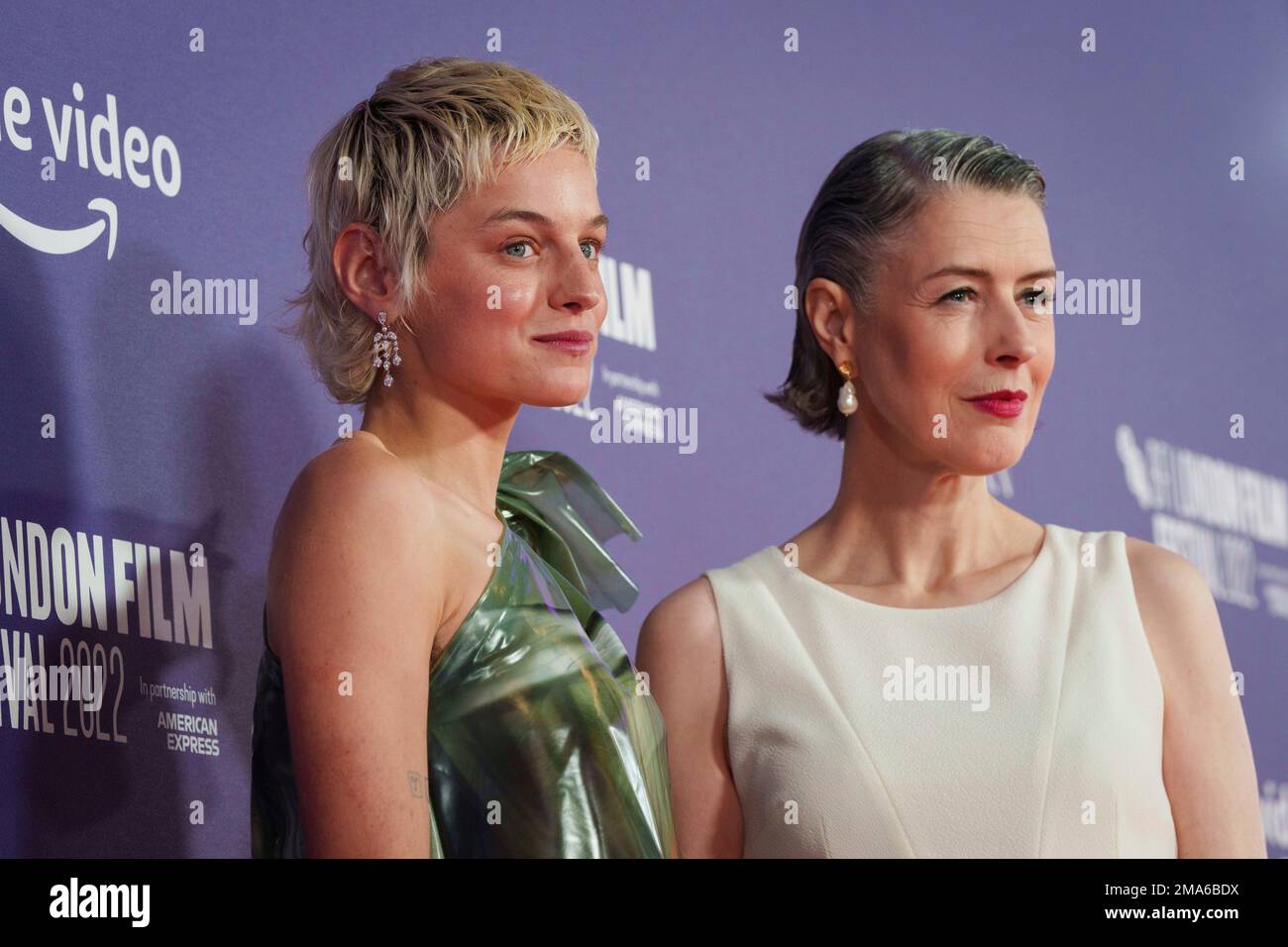 Gina McKee, left and Emma Corrin pose for photographers upon arrival ...