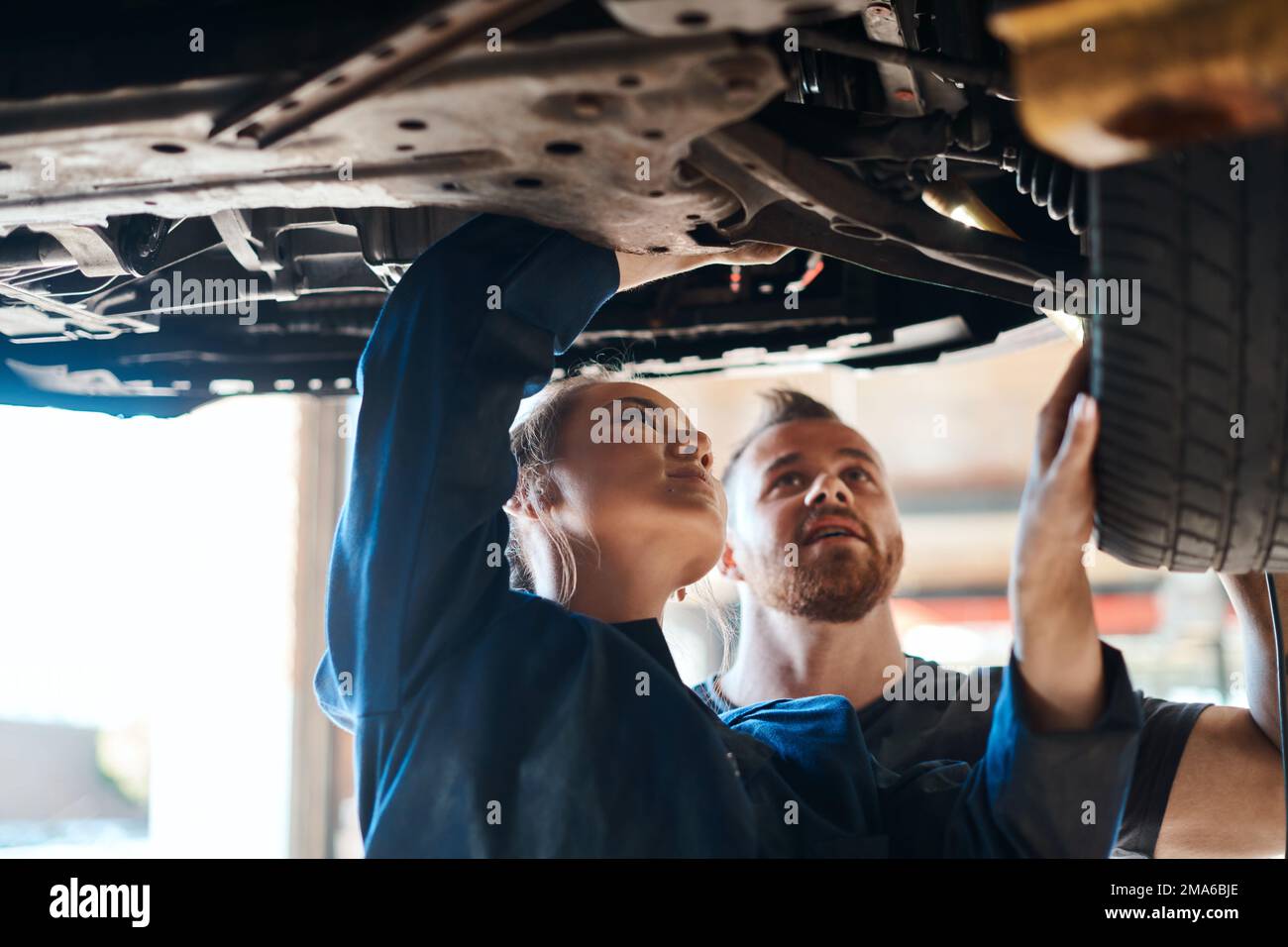 Inside garage two mechanics hi-res stock photography and images - Alamy