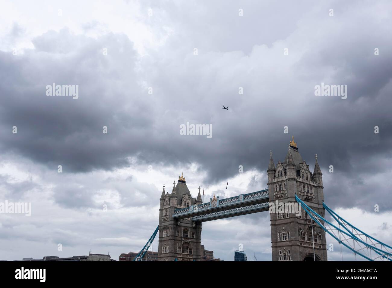Passenger plane over Tower Bridge, London, Great Britain Stock Photo ...