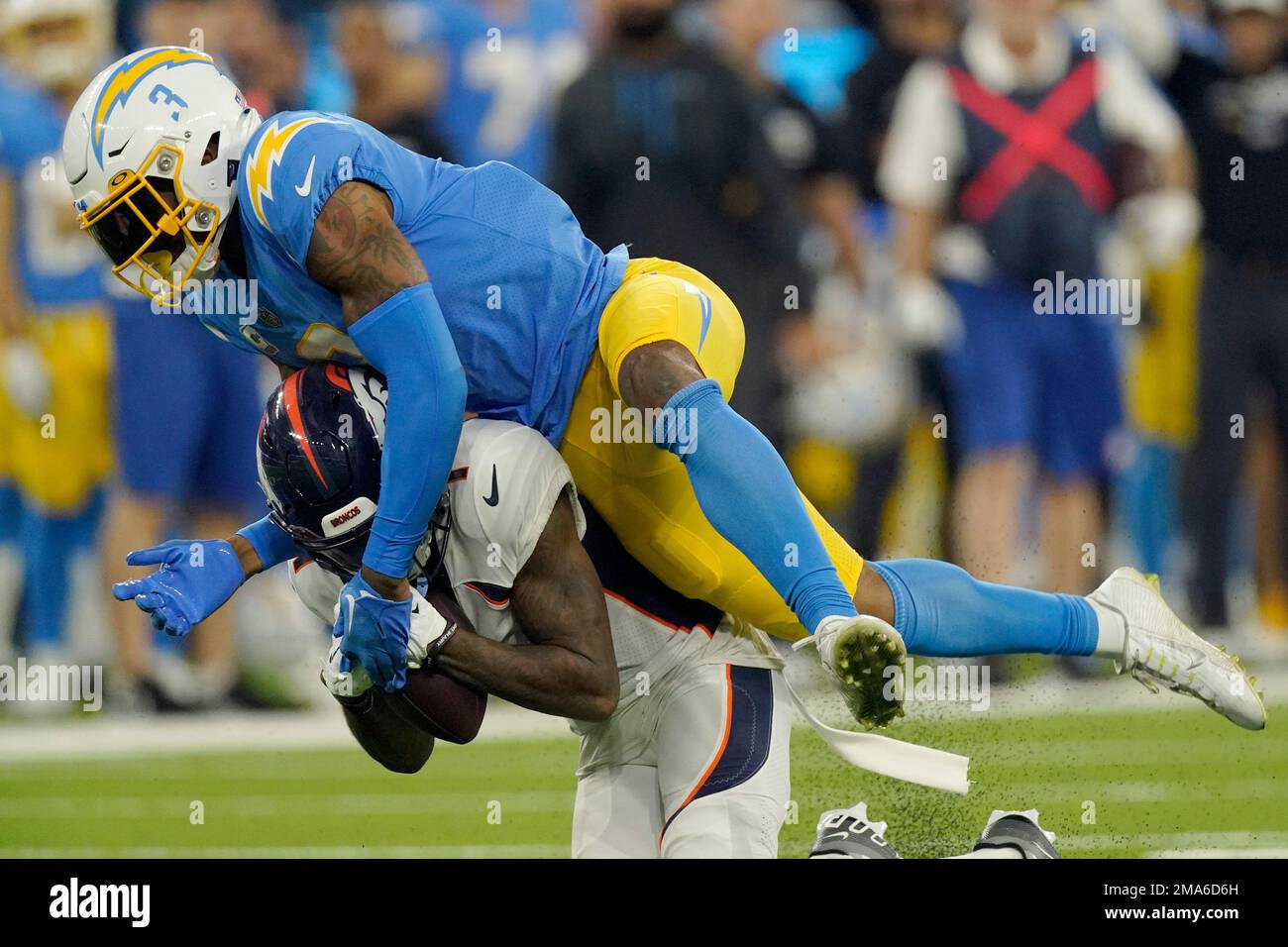 Denver Broncos wide receiver KJ Hamler is tackled by Los Angeles ...