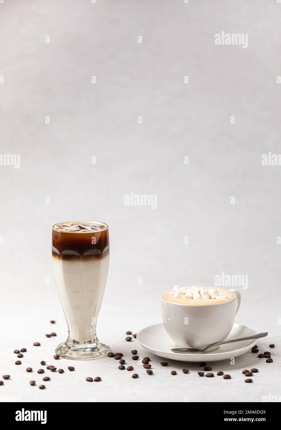 Two drinks cappuccino and iced coffee Stock Photo - Alamy