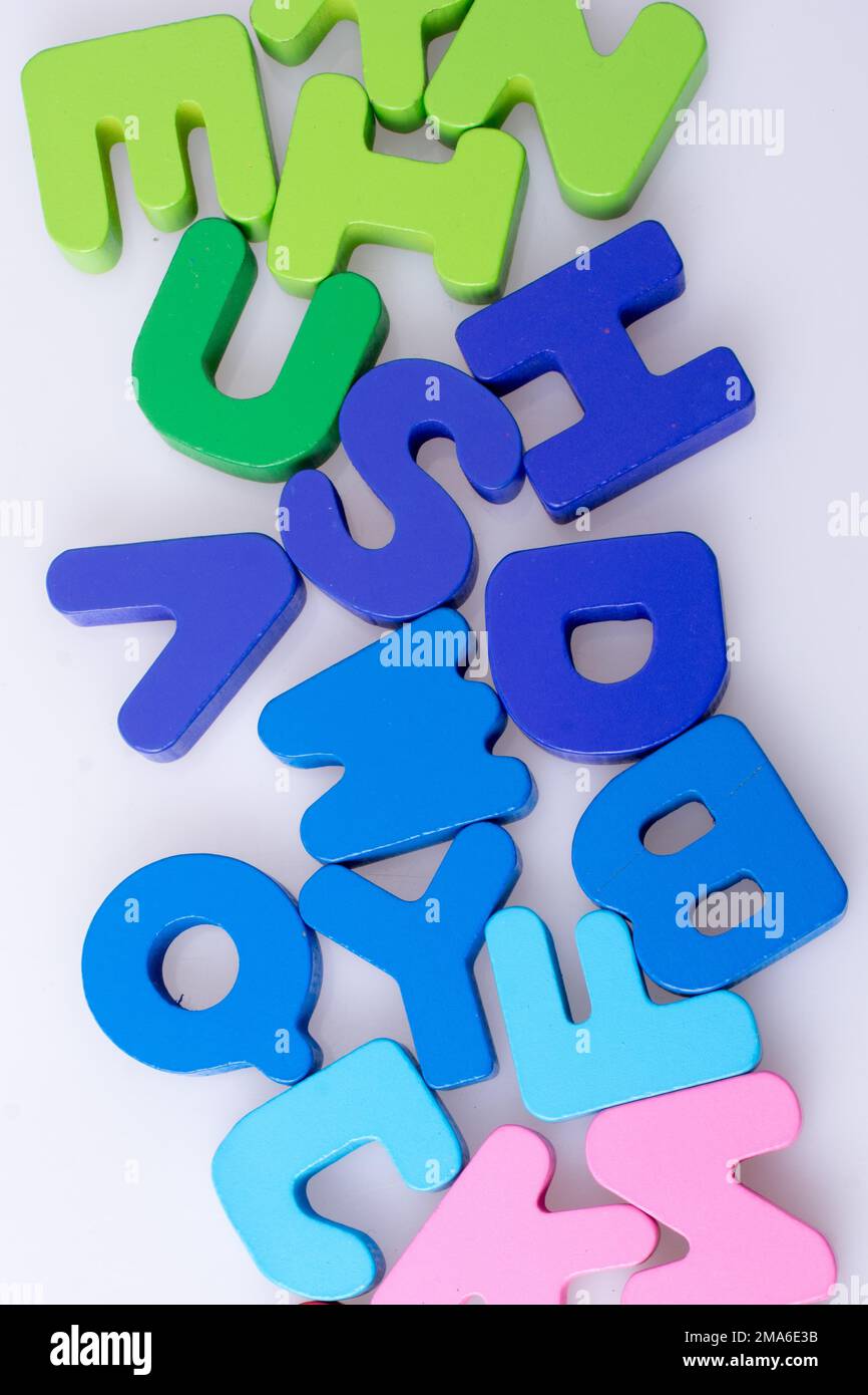 Colorful alphabet letter blocks scattered randomly on white background ...