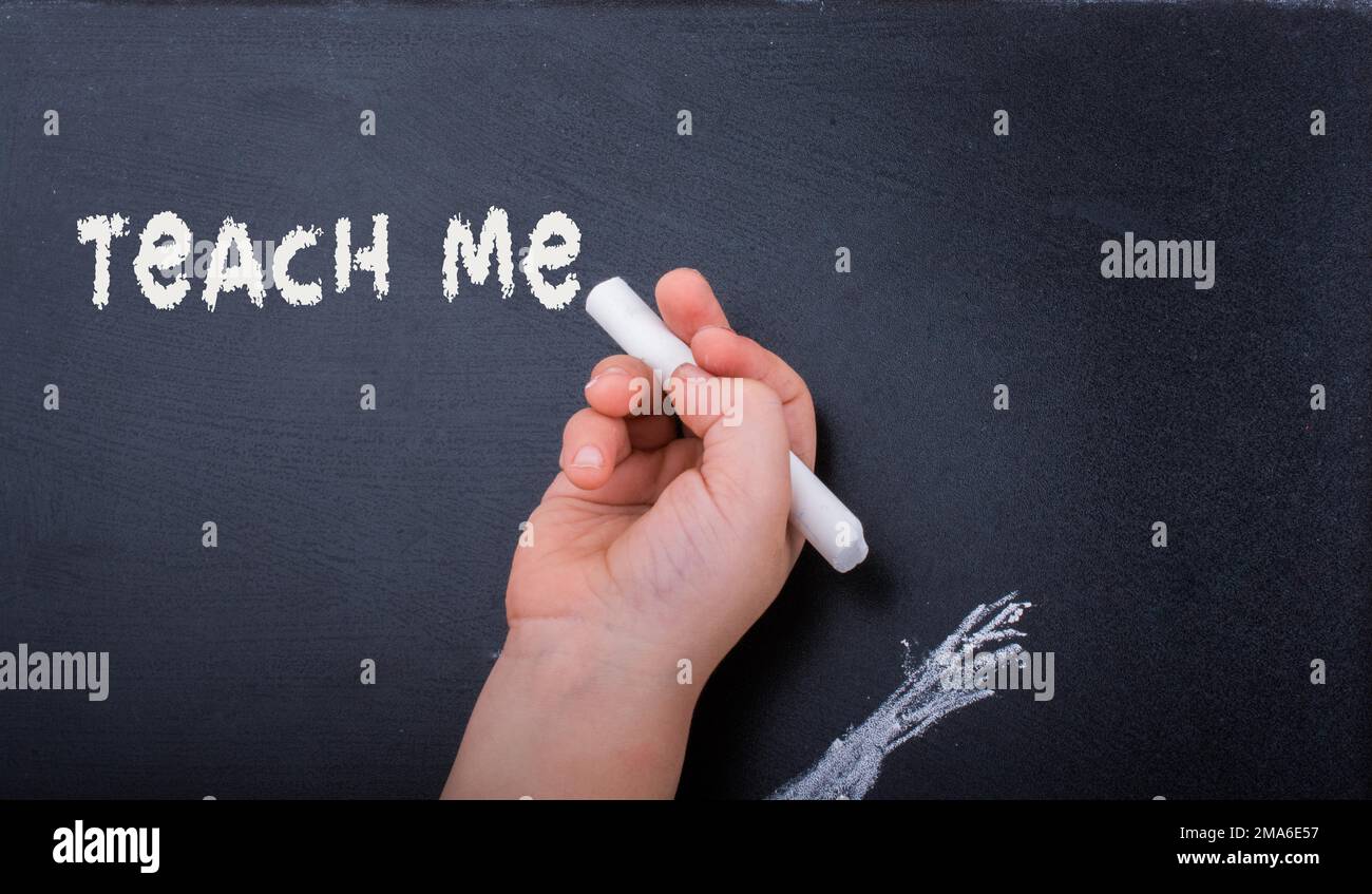 Hand holding white chalk and black board Stock Photo - Alamy