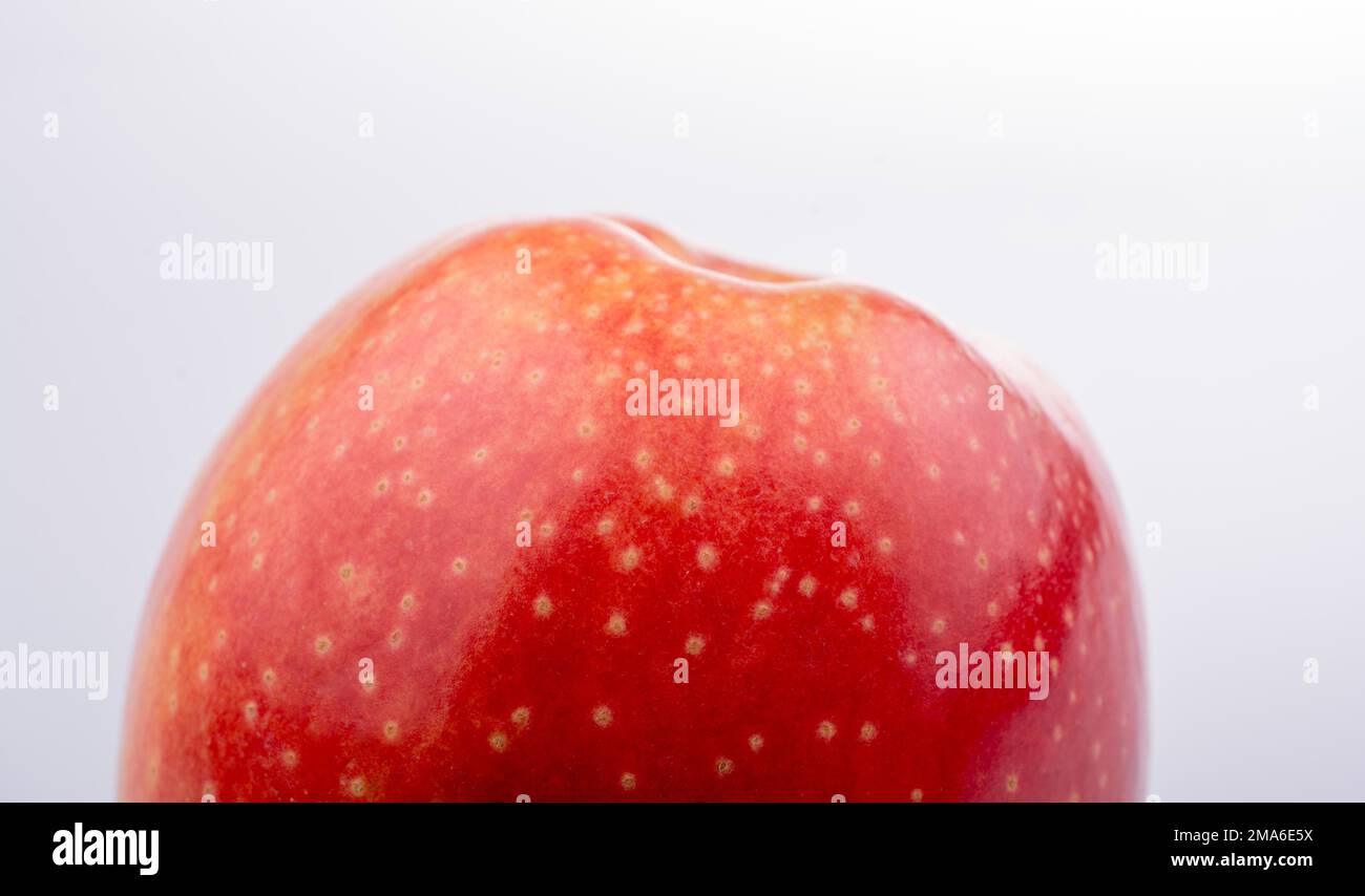 Red apple with dots in close up view Stock Photo - Alamy