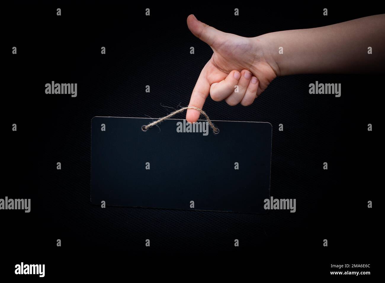Rectangular shaped black notice board in hand on black background Stock ...
