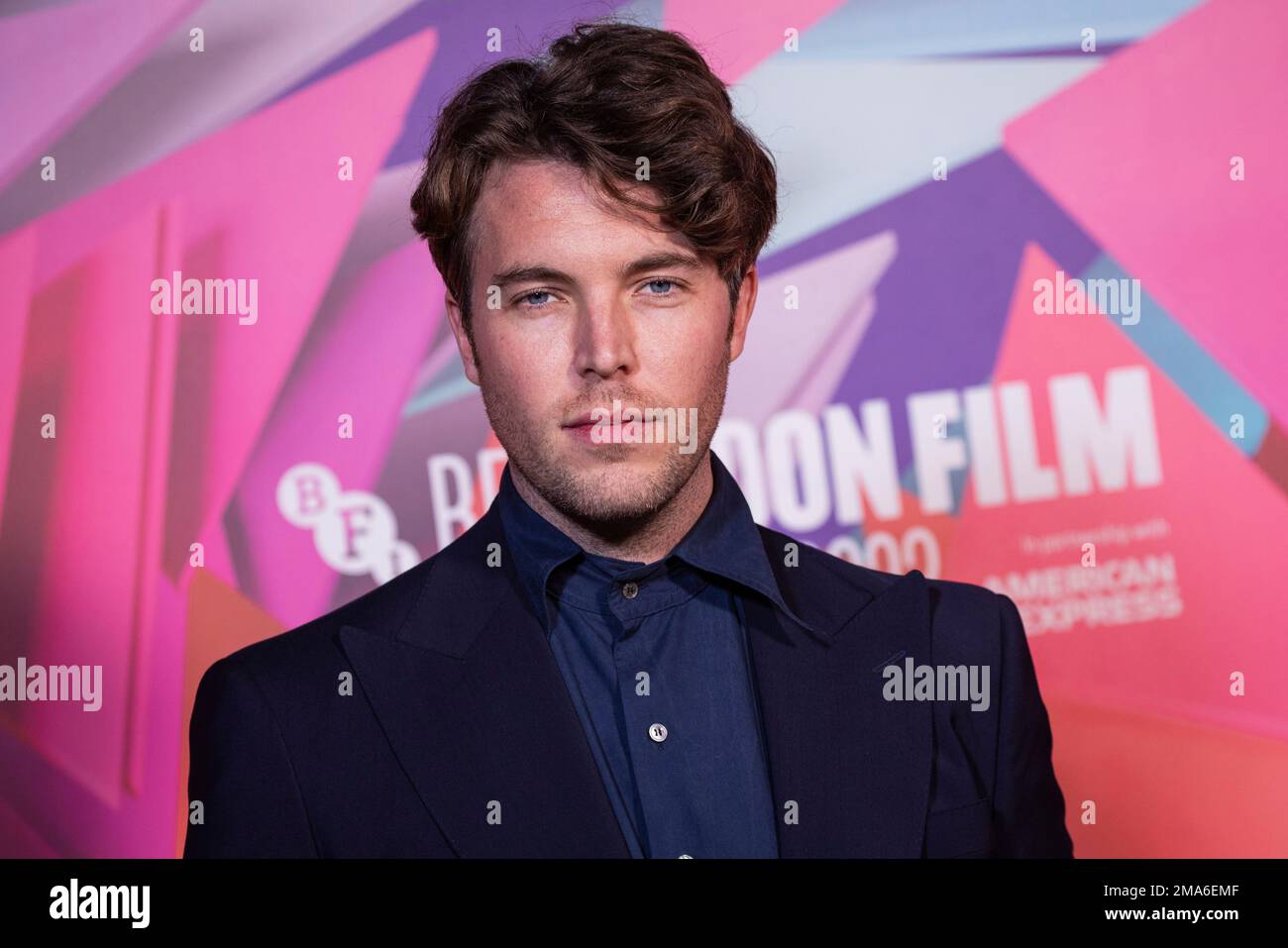 Tom Hughes poses for photographers upon arrival for the premiere of the ...