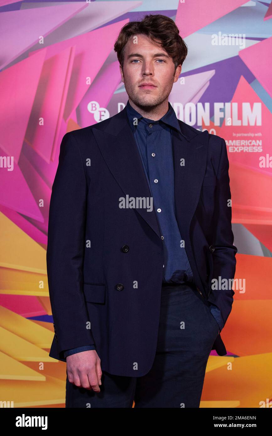 Tom Hughes poses for photographers upon arrival for the premiere of the ...