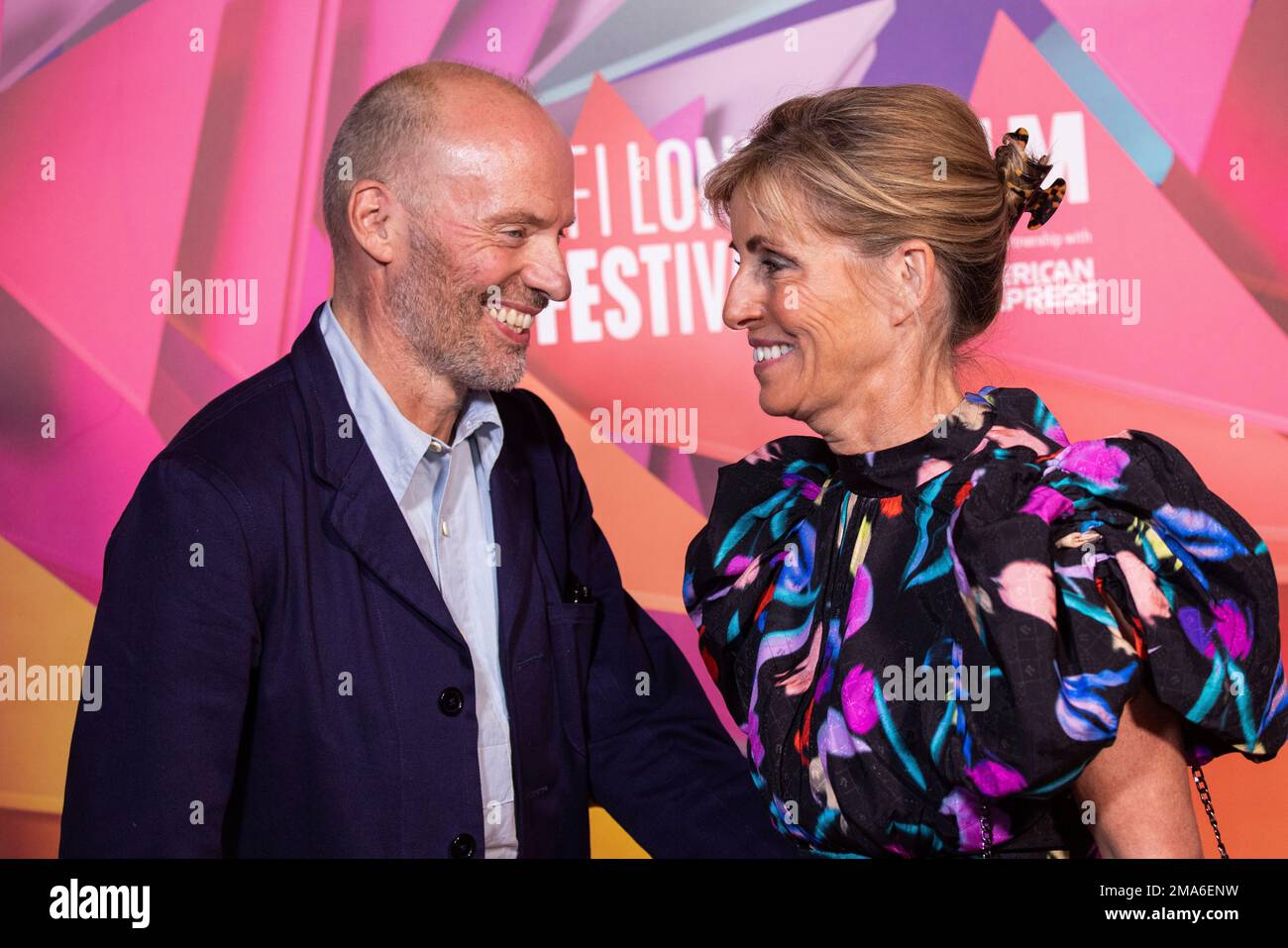 Director Hugo Blick and Elinor Morriston pose for photographers upon arrival for the premiere of ...